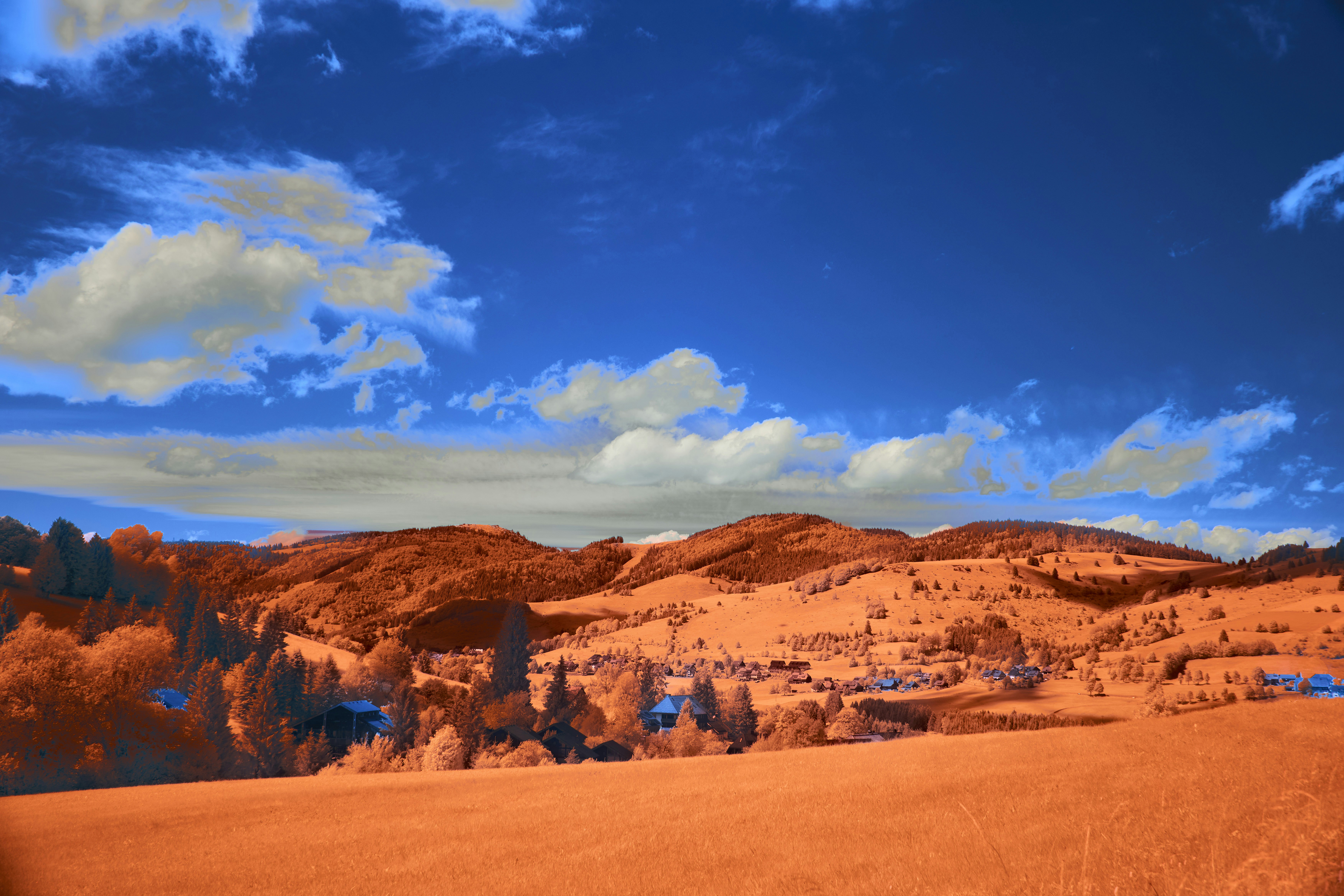 Crimson Valleys Under Cerulean Skies