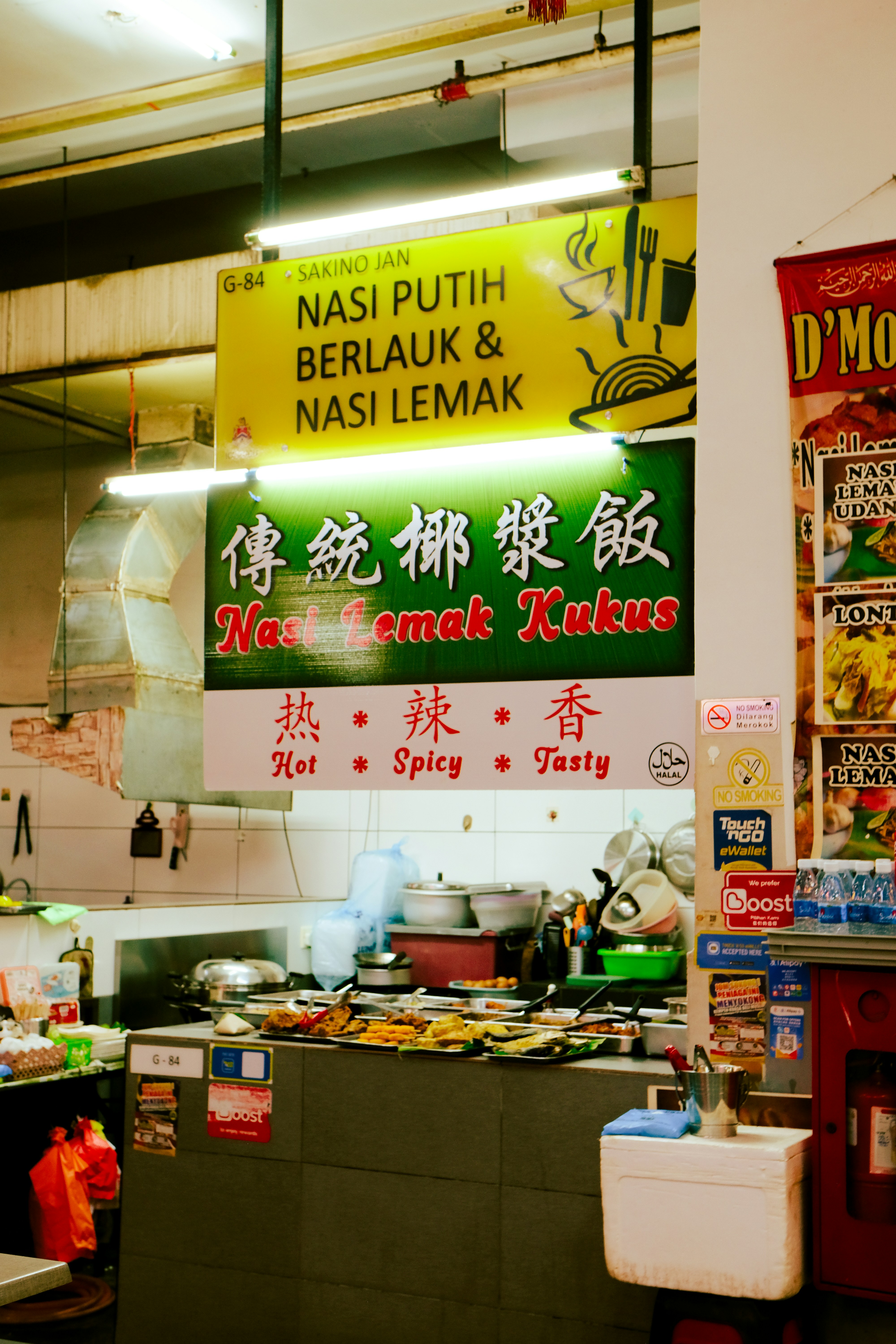Luminous Stallfront: A Neon Signage Parade over a Bustling Open Kitchen