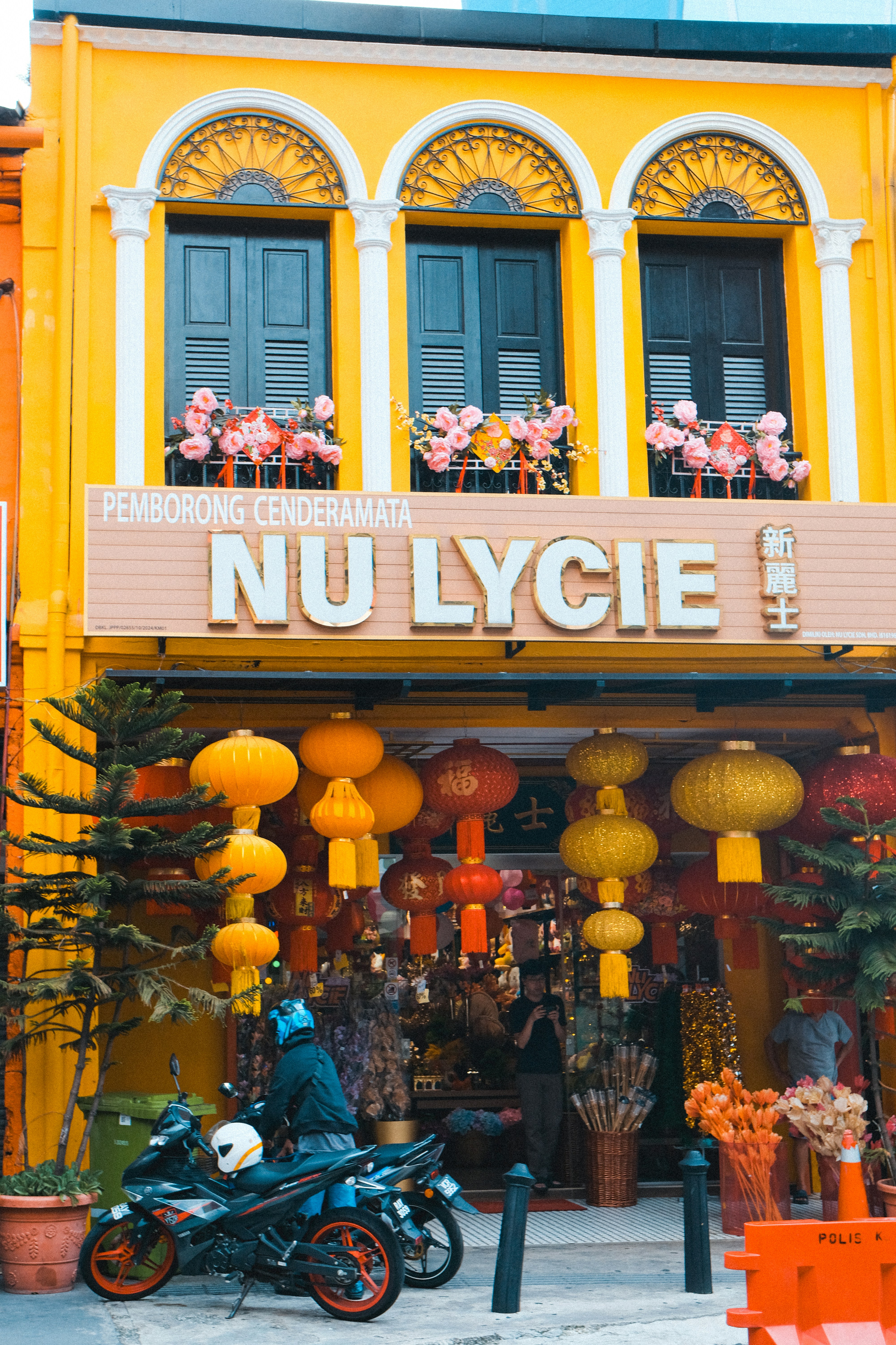Bright Facade, Lanterns, and a Bustling Shopfront in NU LY CIE