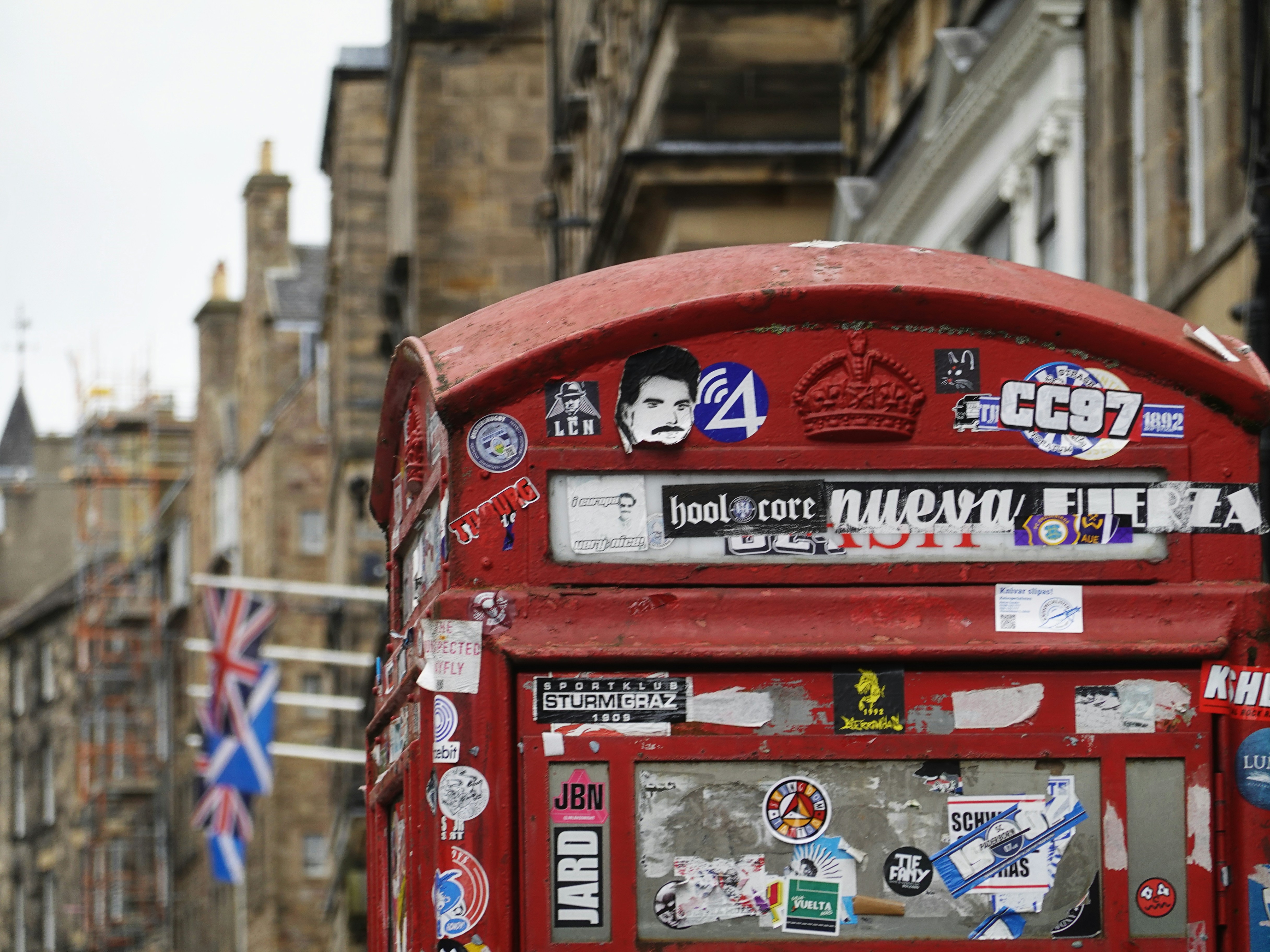 Red Dossier: A London Phone Booth Draped in Stickers