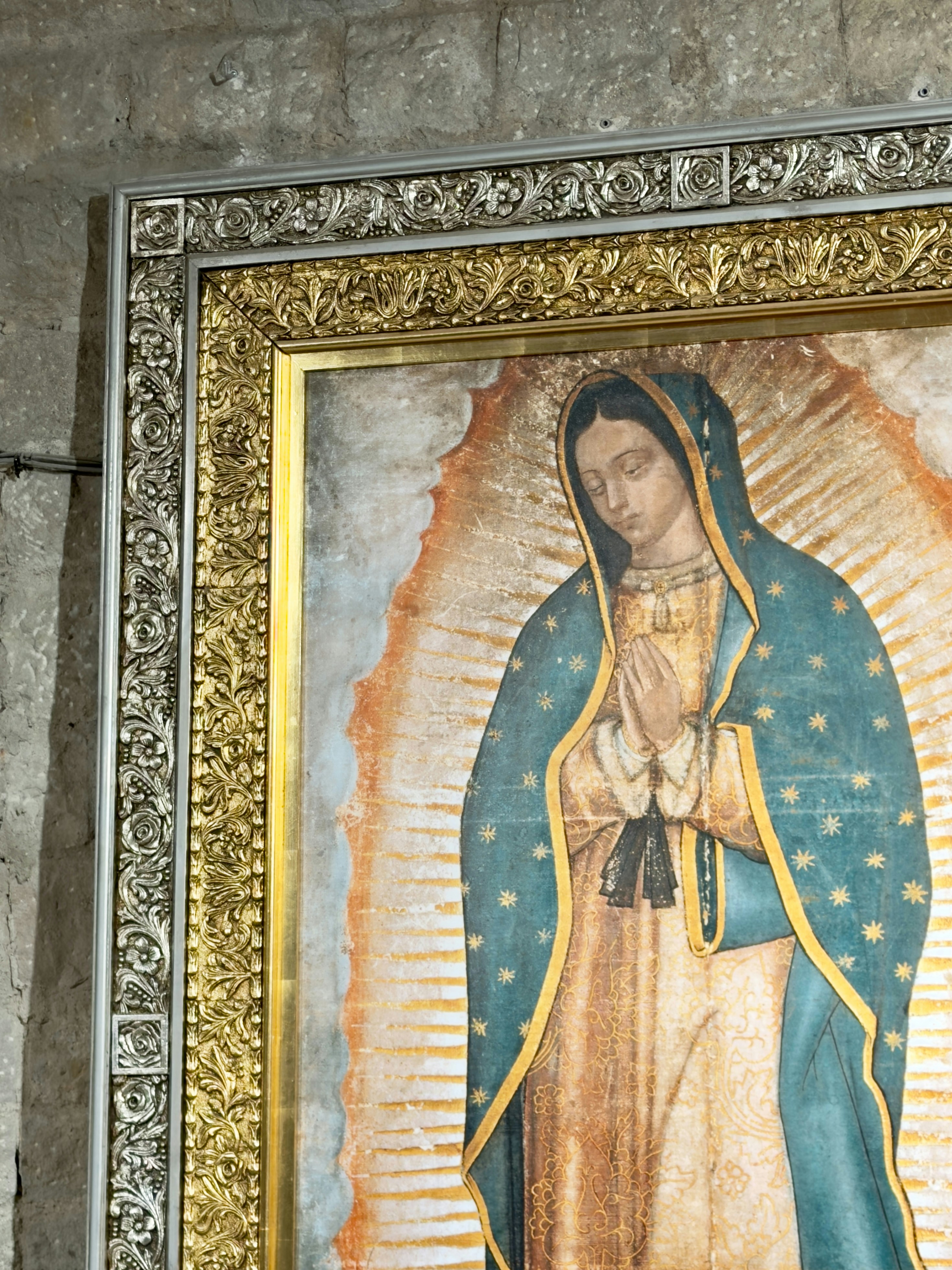 Hushed Reverence: The Virgin in a Framed Gilded Glow