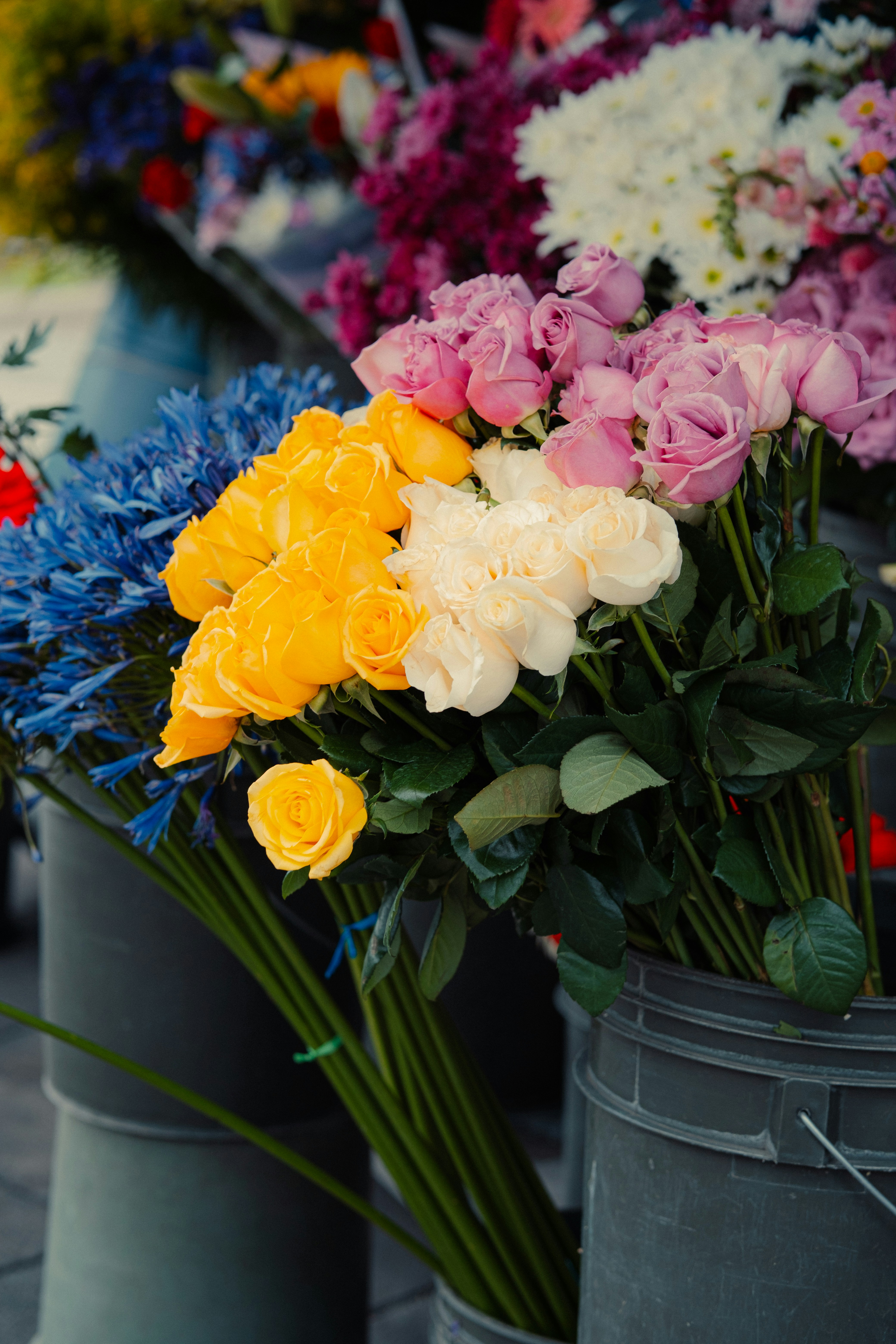 Bouquet Symphony: Sunset Yellow, Ivory, and Blush Roses in a Floral Cascade