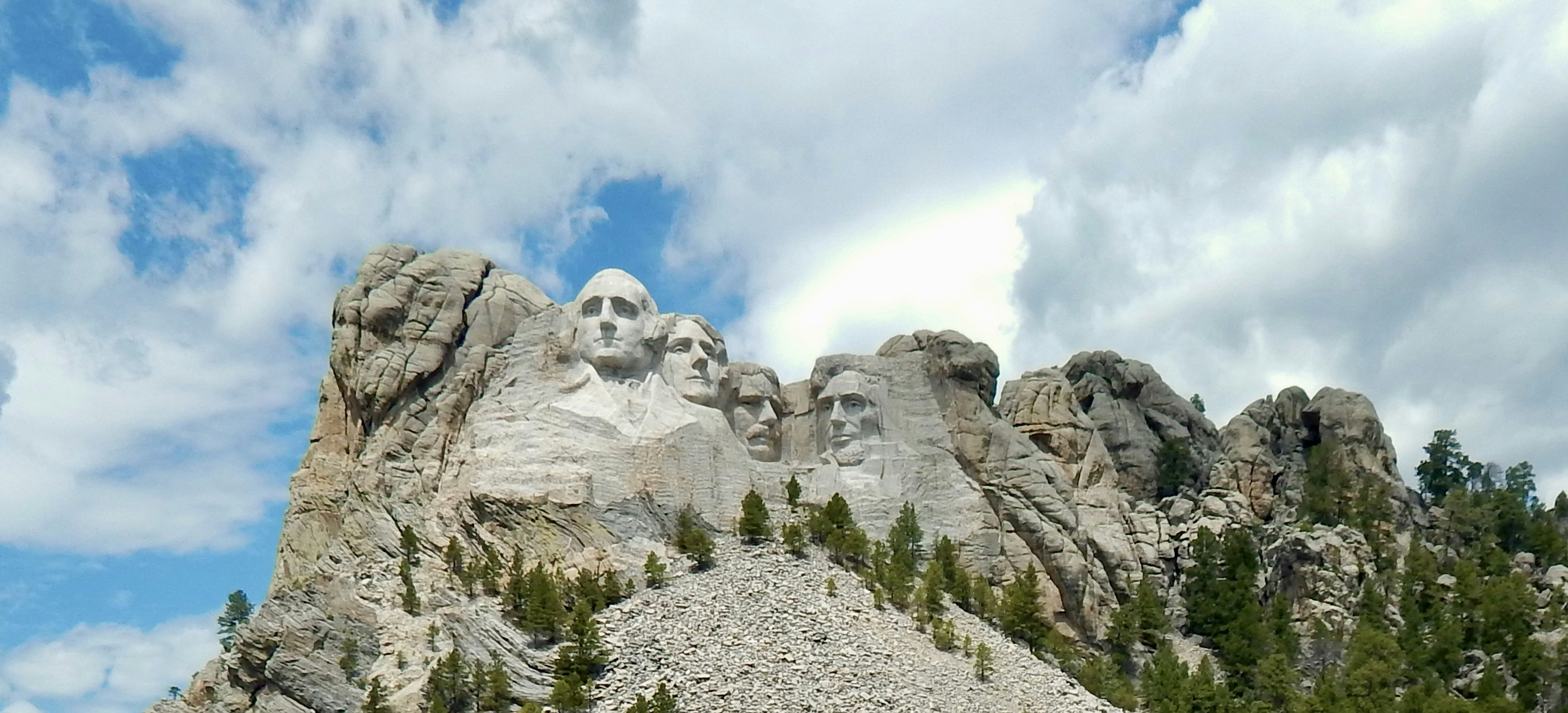 Carl of Granite: Faces Carved into Stone Above the Treeline