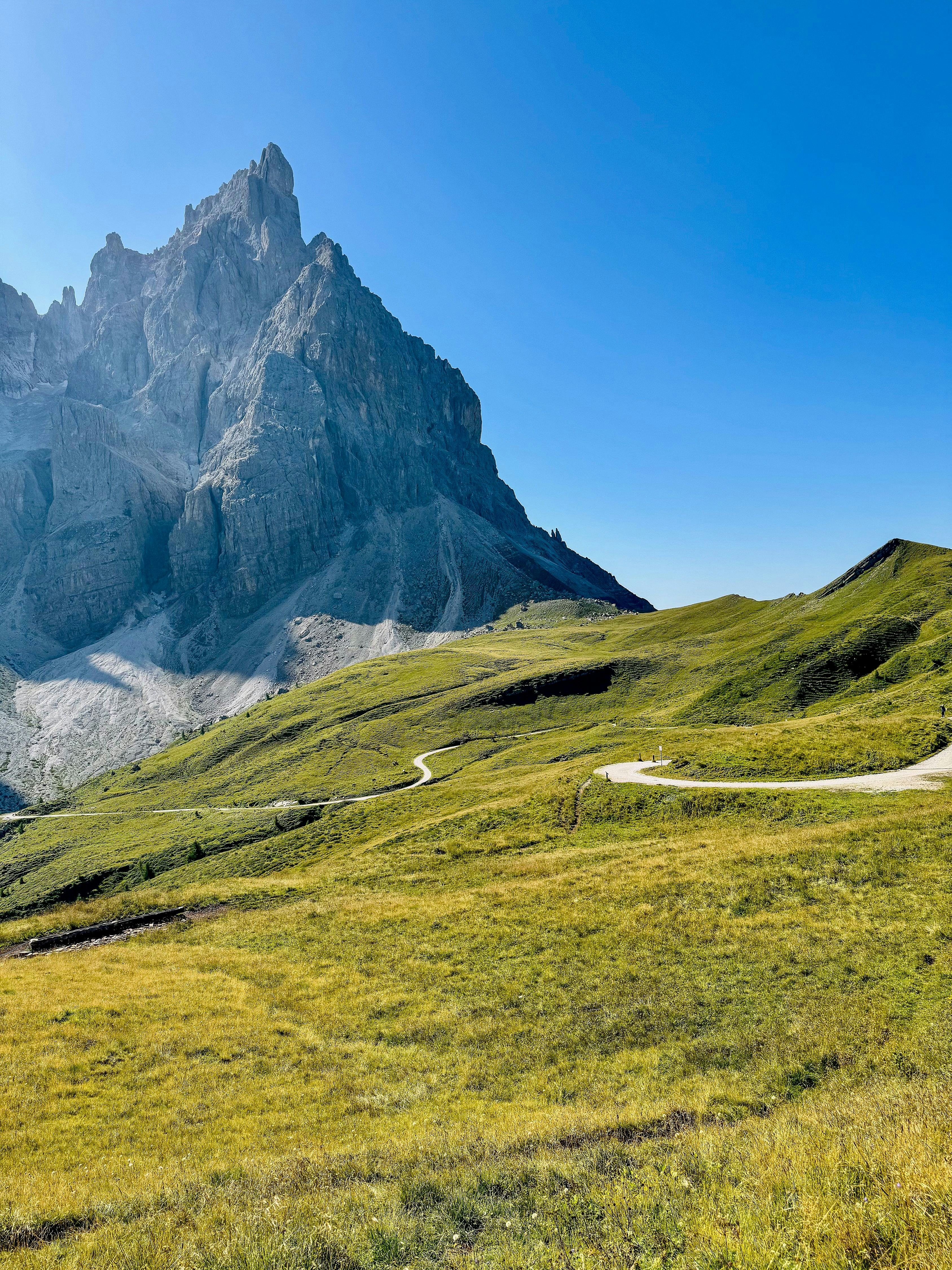 Spire and Switchback: A Mountain Path Through Alpine Greens