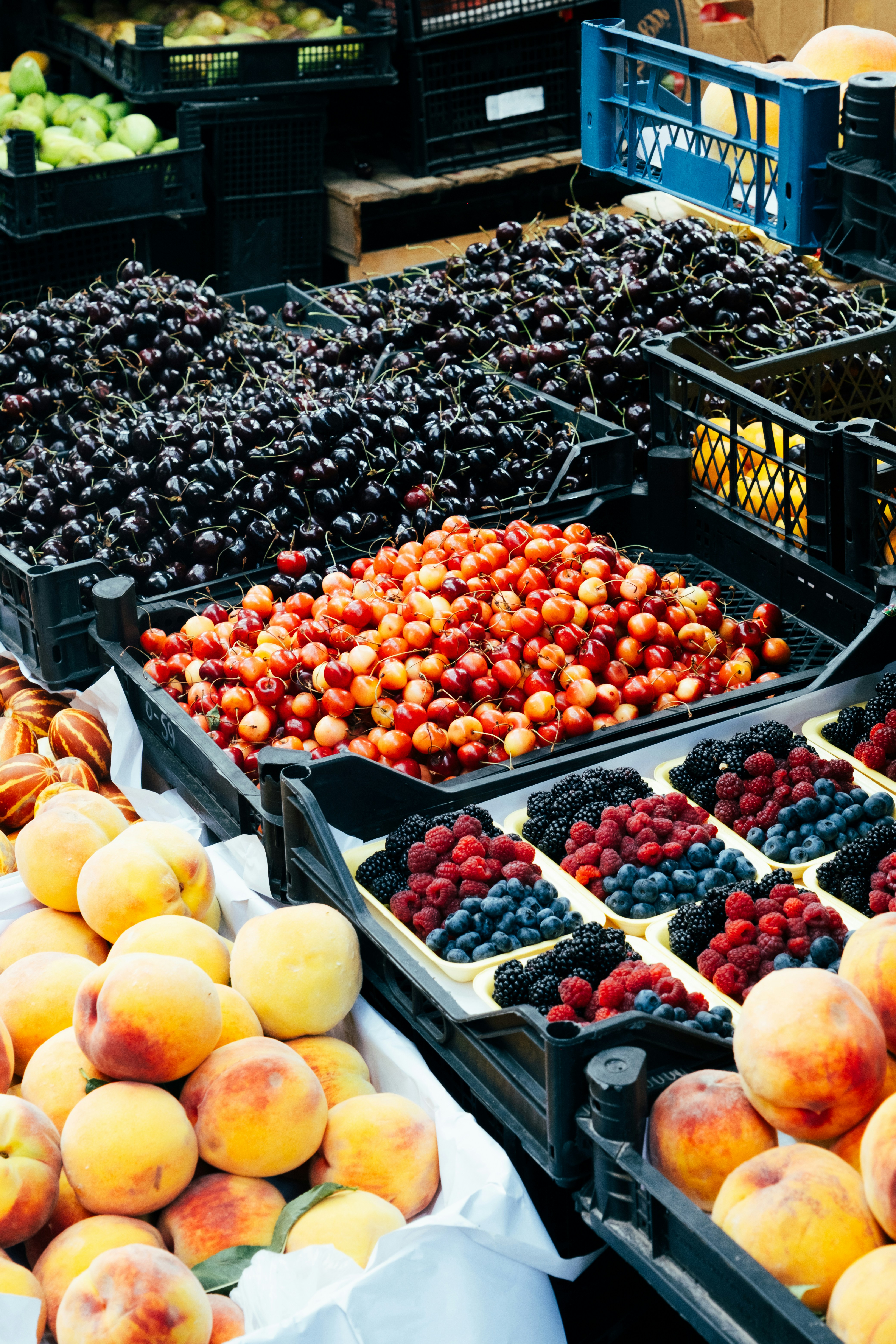 Crates of Rubies and Golds: A Bustling Market Stall