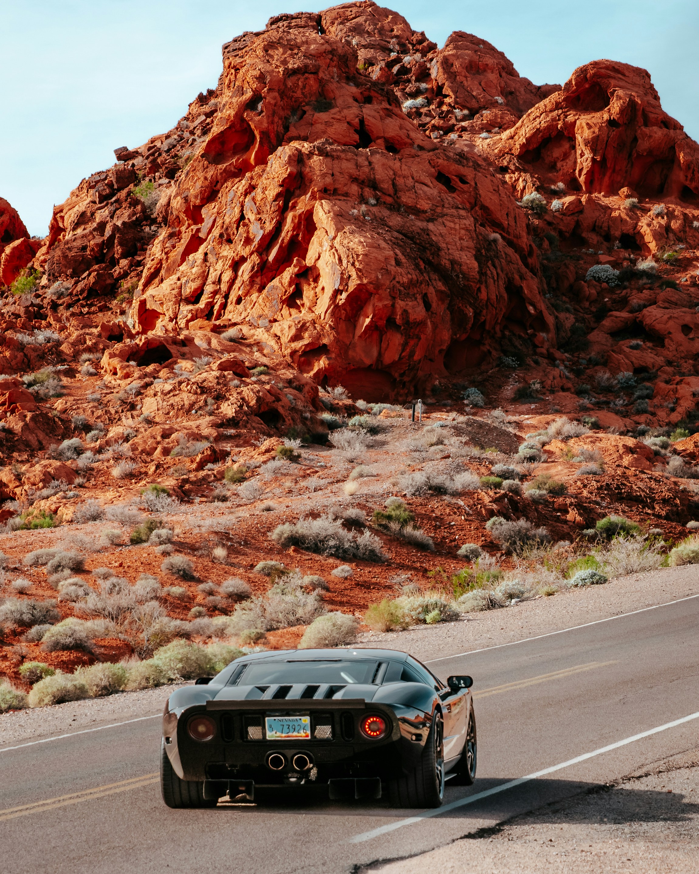 Burnished Red Rocks Meet a Moonlit Road