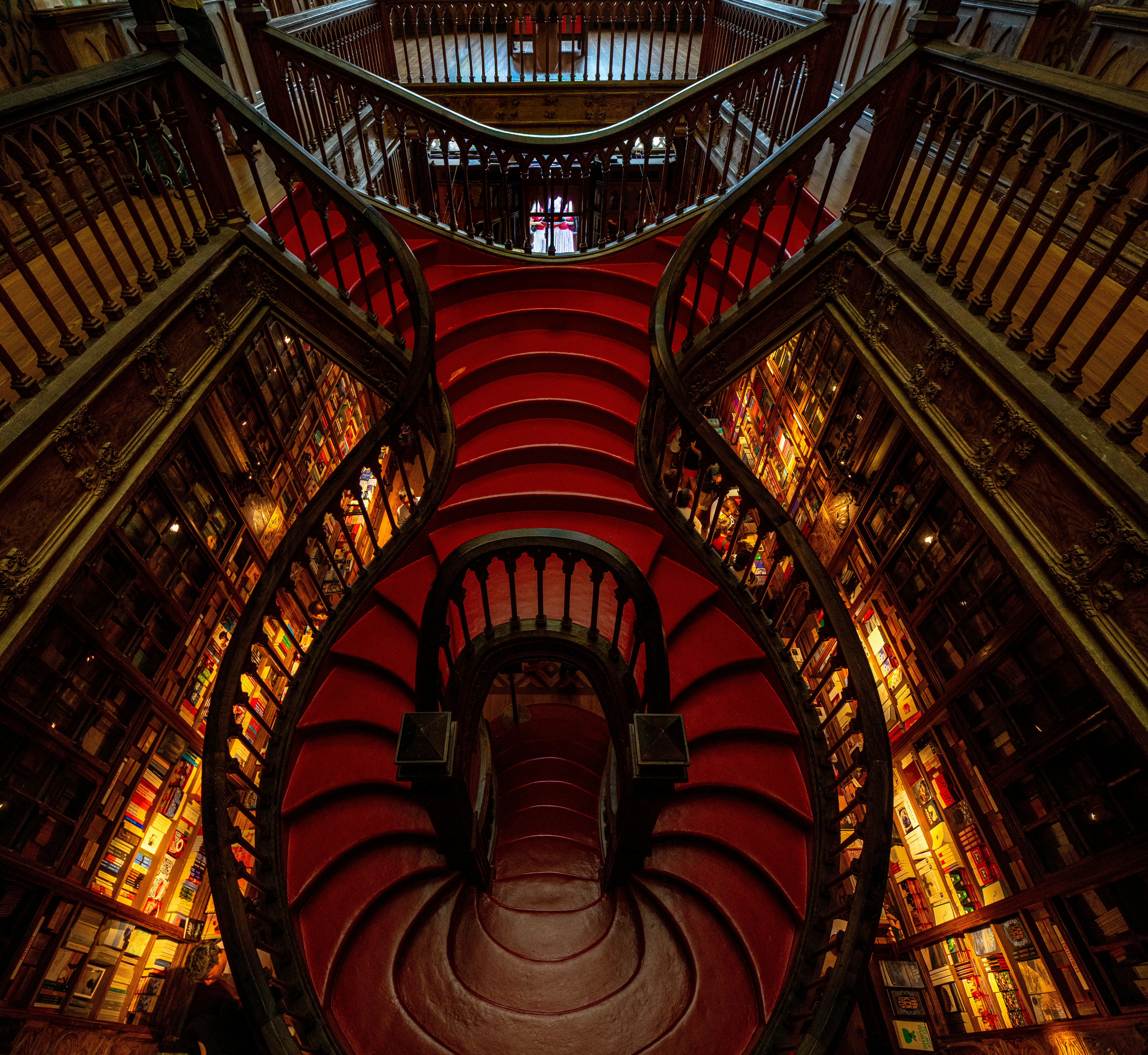The Crimson Spiral: A Grand Staircase of Books and Echoes