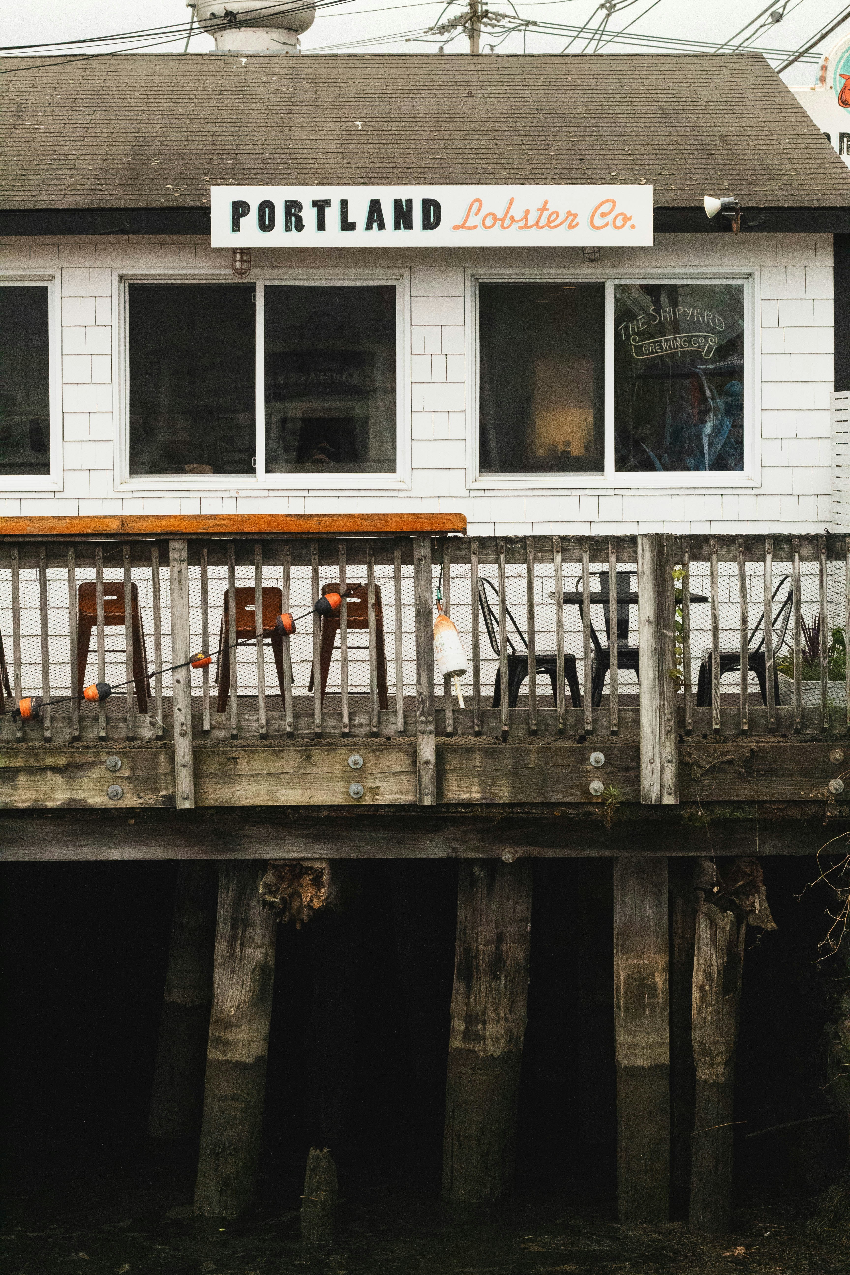 Lobster House by the Pier: A Seaside Café Framed by Weathered Piers