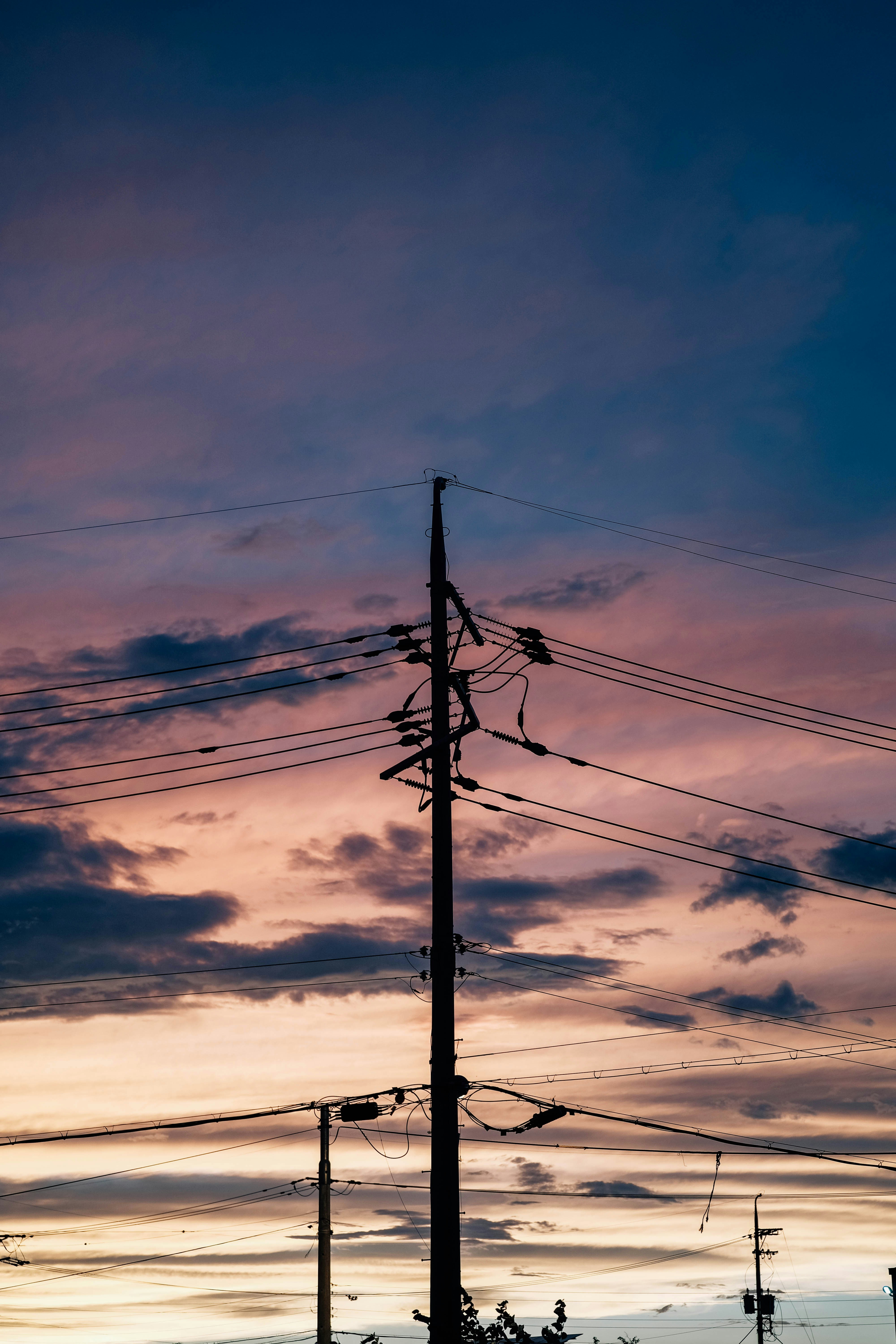 Silhouetted Utility Skyline at Sunset