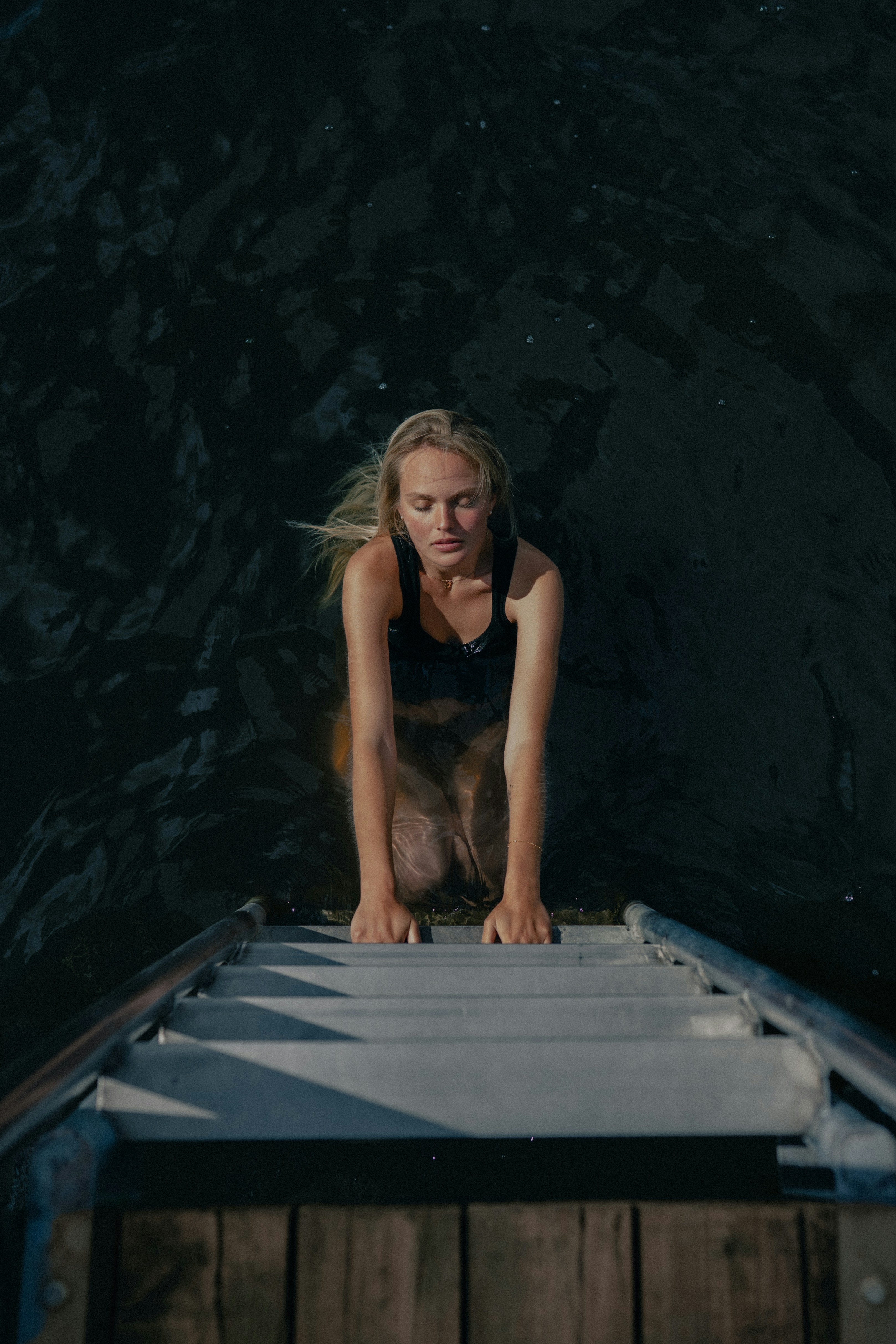 Cliffside Ascent: A Moment at the Ladder's Edge