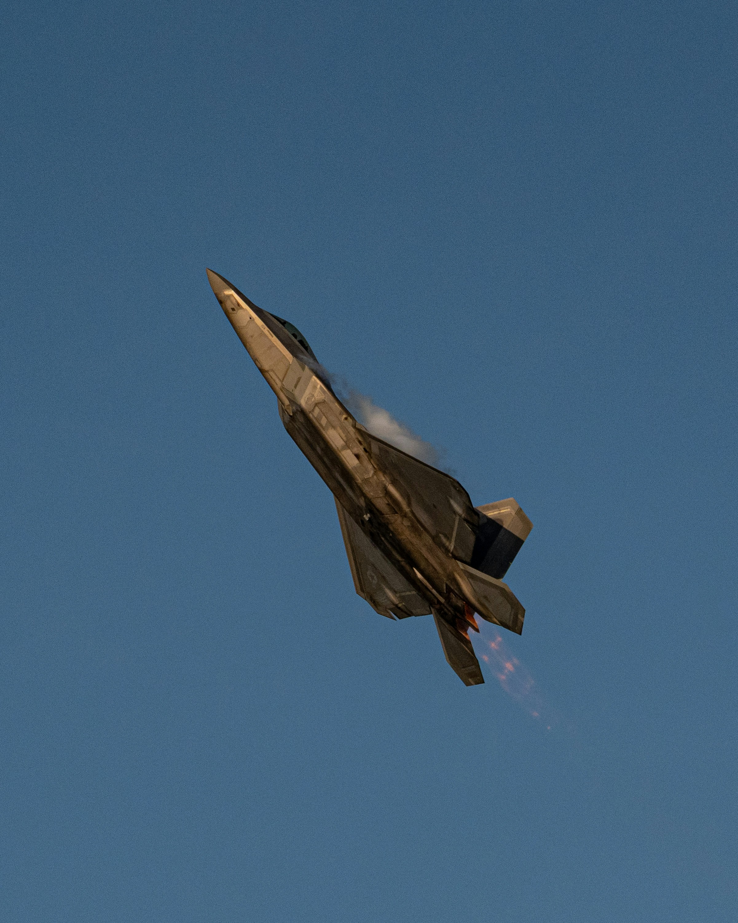 Soaring Phantom: A Fighter Jet Breaks Free in a Clear Sky