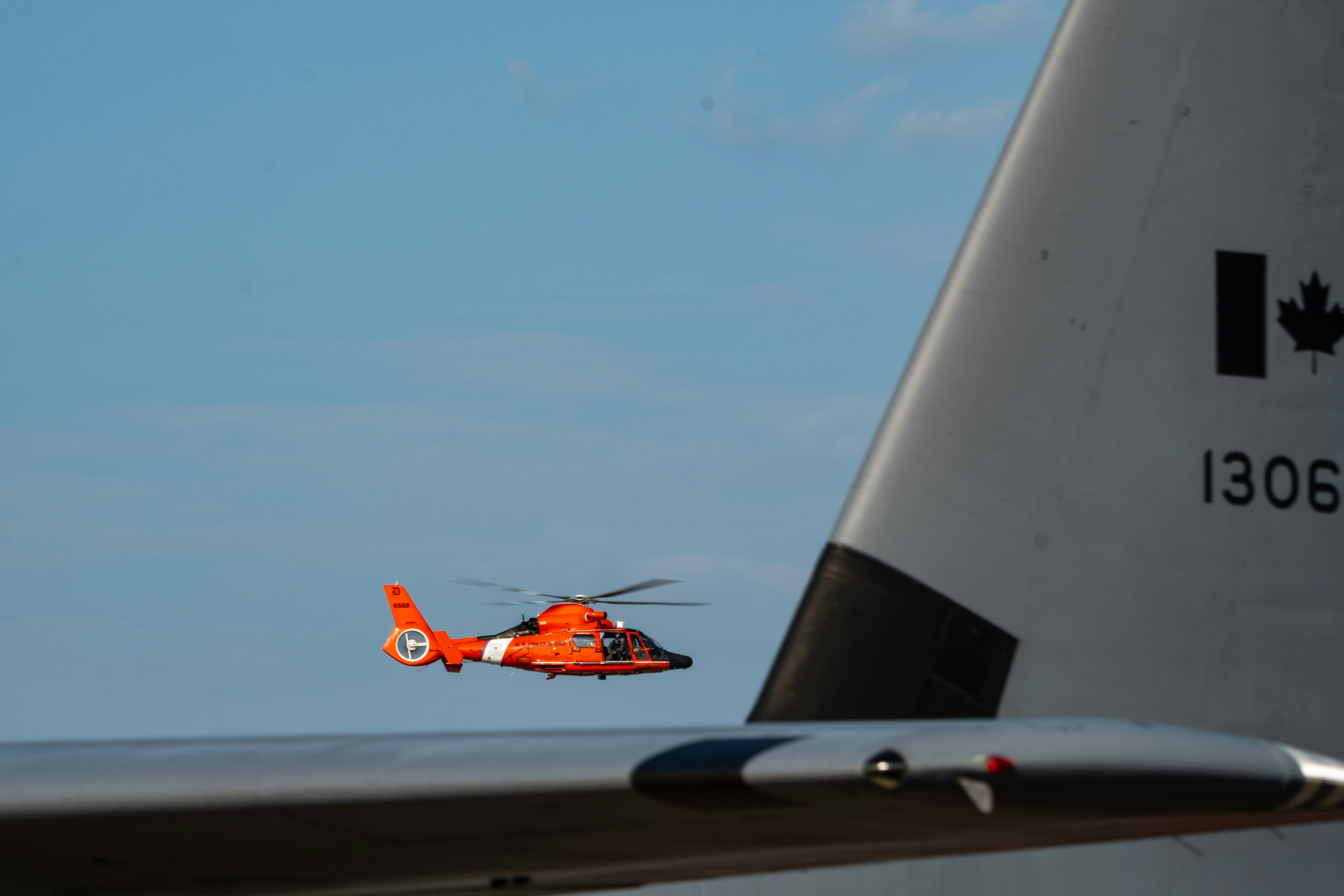 Red Rescue Blade: Orange helicopter in flight near a wingtip