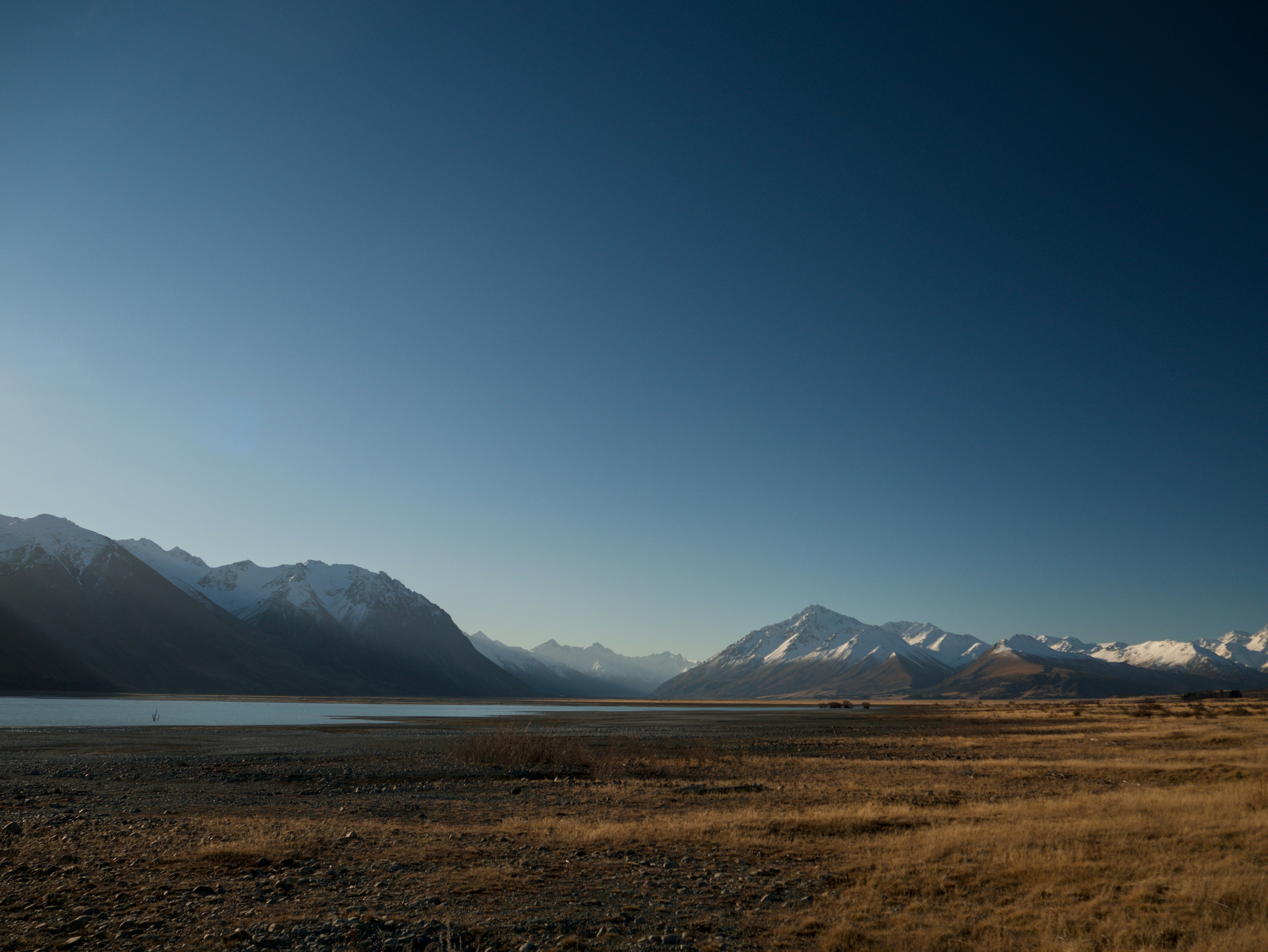 Quiet Fjord Under a Vast Midday Sky