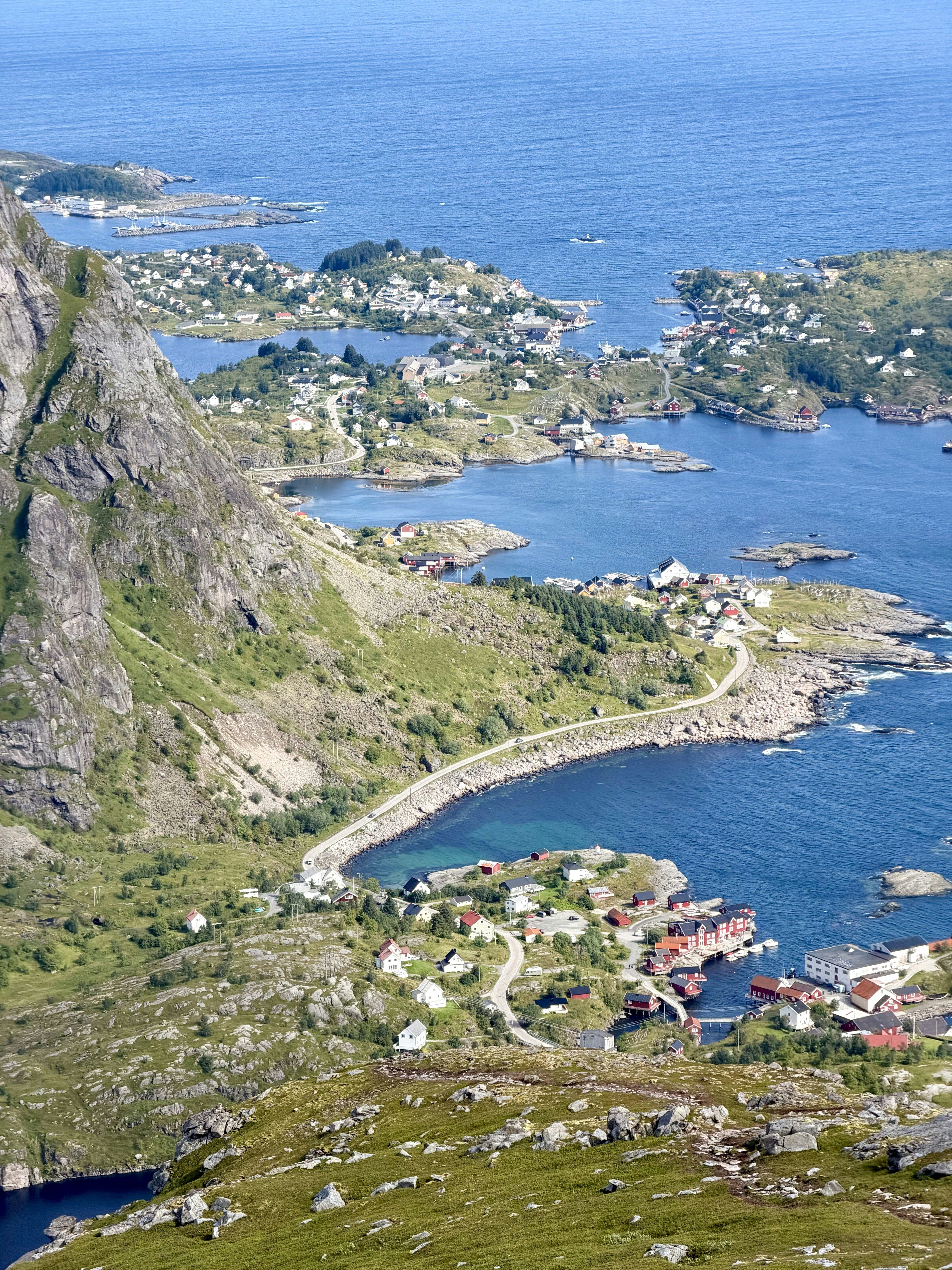 Coastal Village Threaded Along a Rugged Fjord