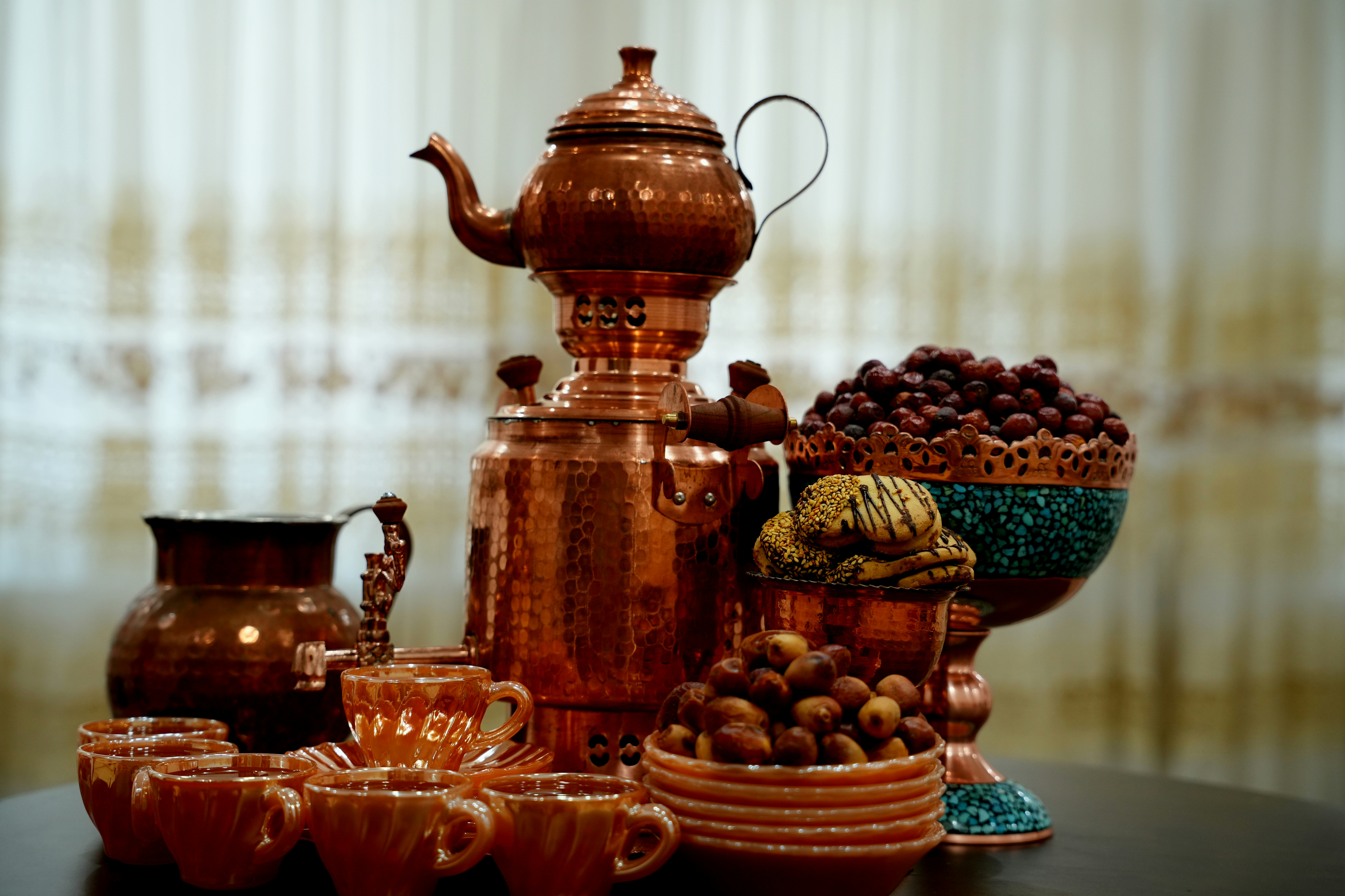 Copper Symphony: A Still Life of Teapots and Berries