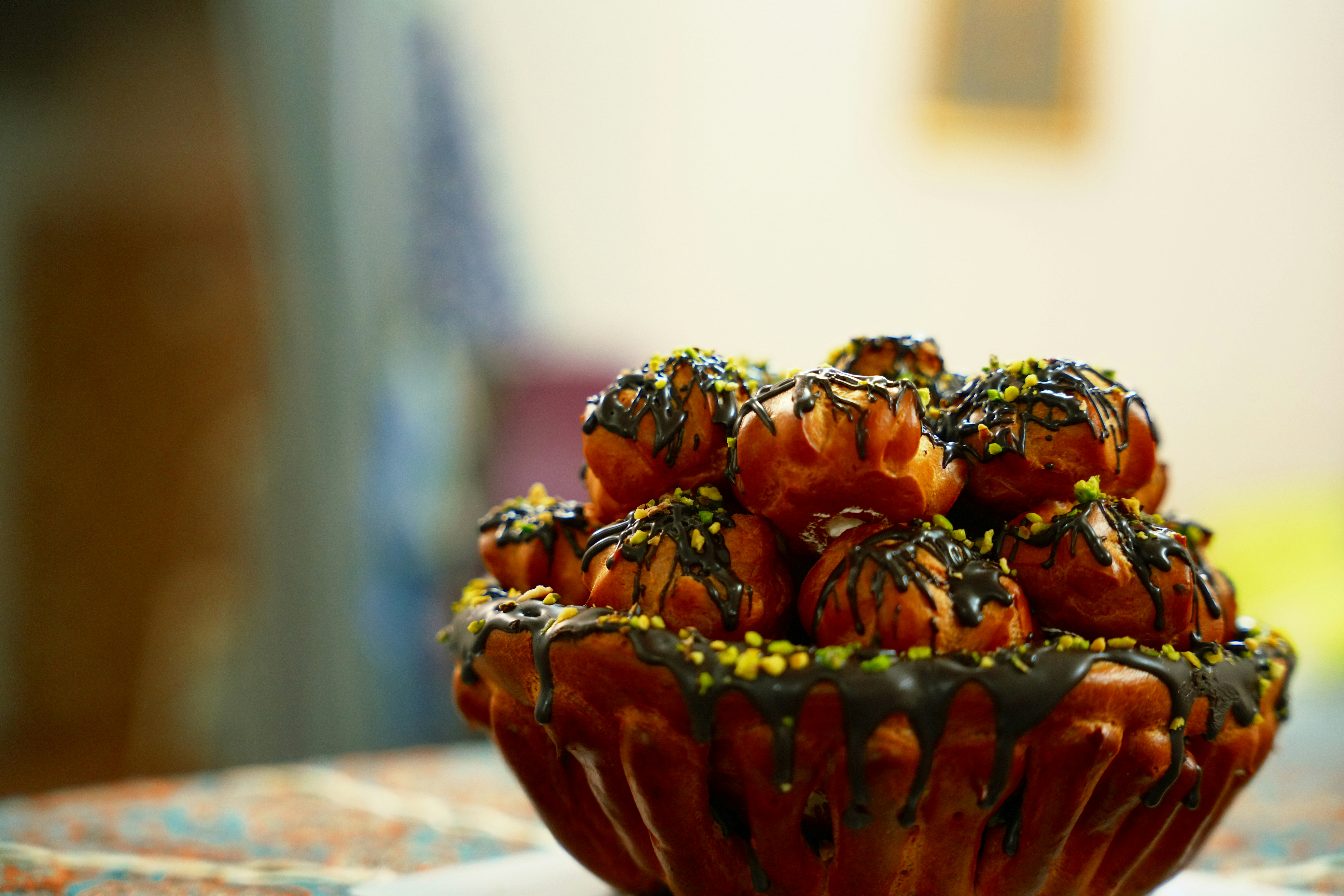 Chocolate Drizzle Fiesta: A Bowl of Glazed Pastries