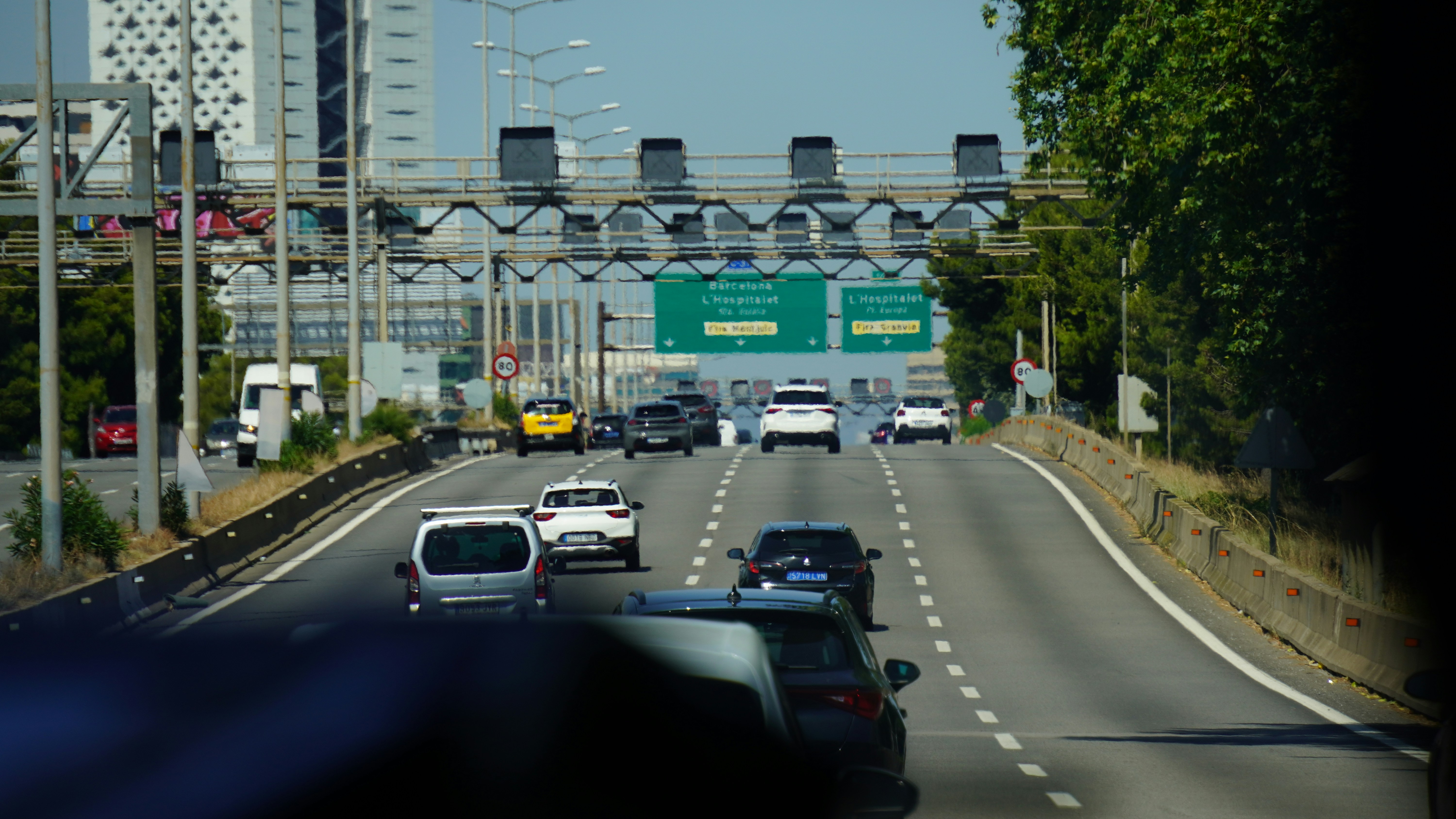 Lane Lines Converge Under the City Sky