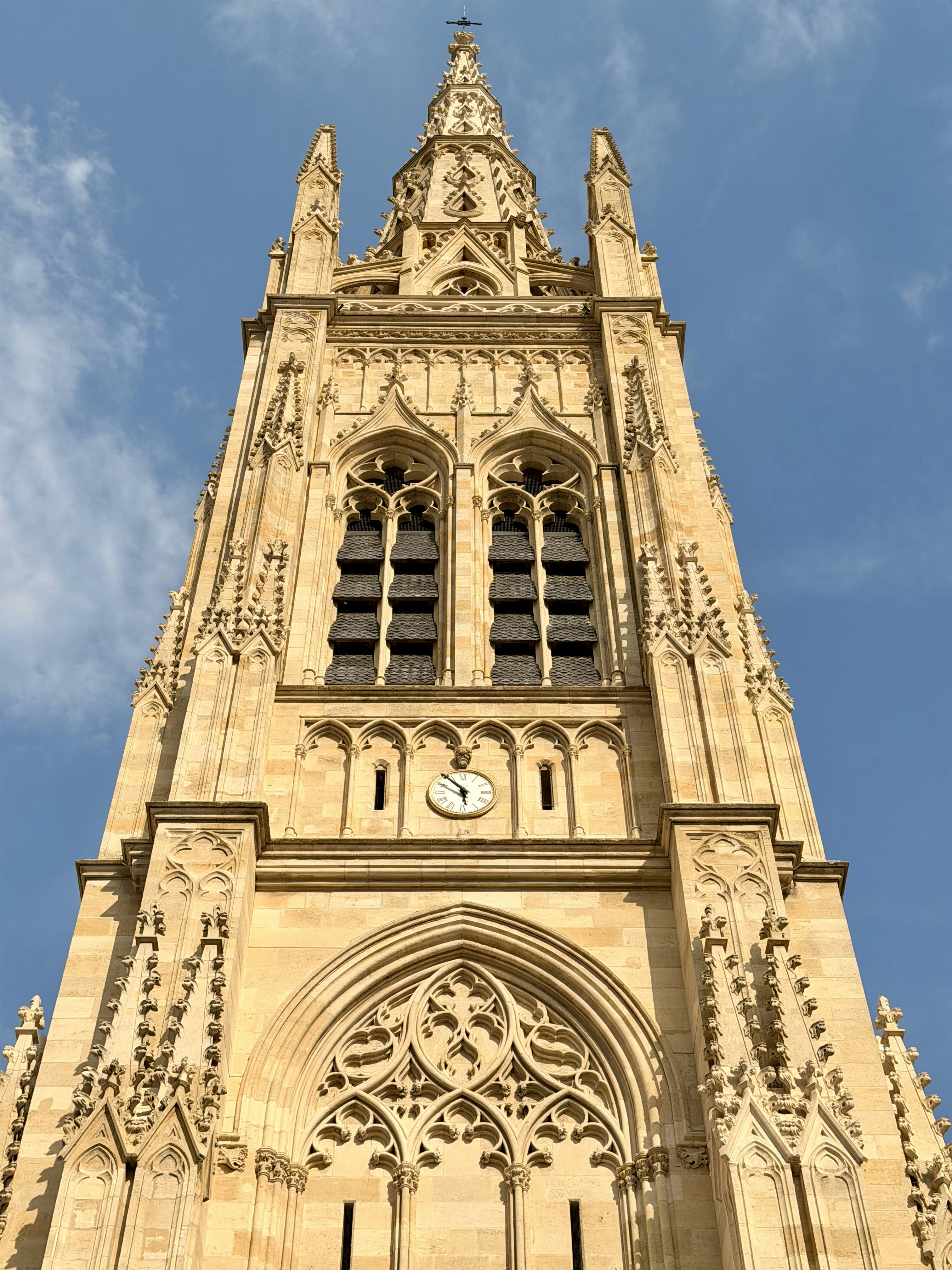 Gothic Cathedral Spire Reaching Skyward Under Clear Blue