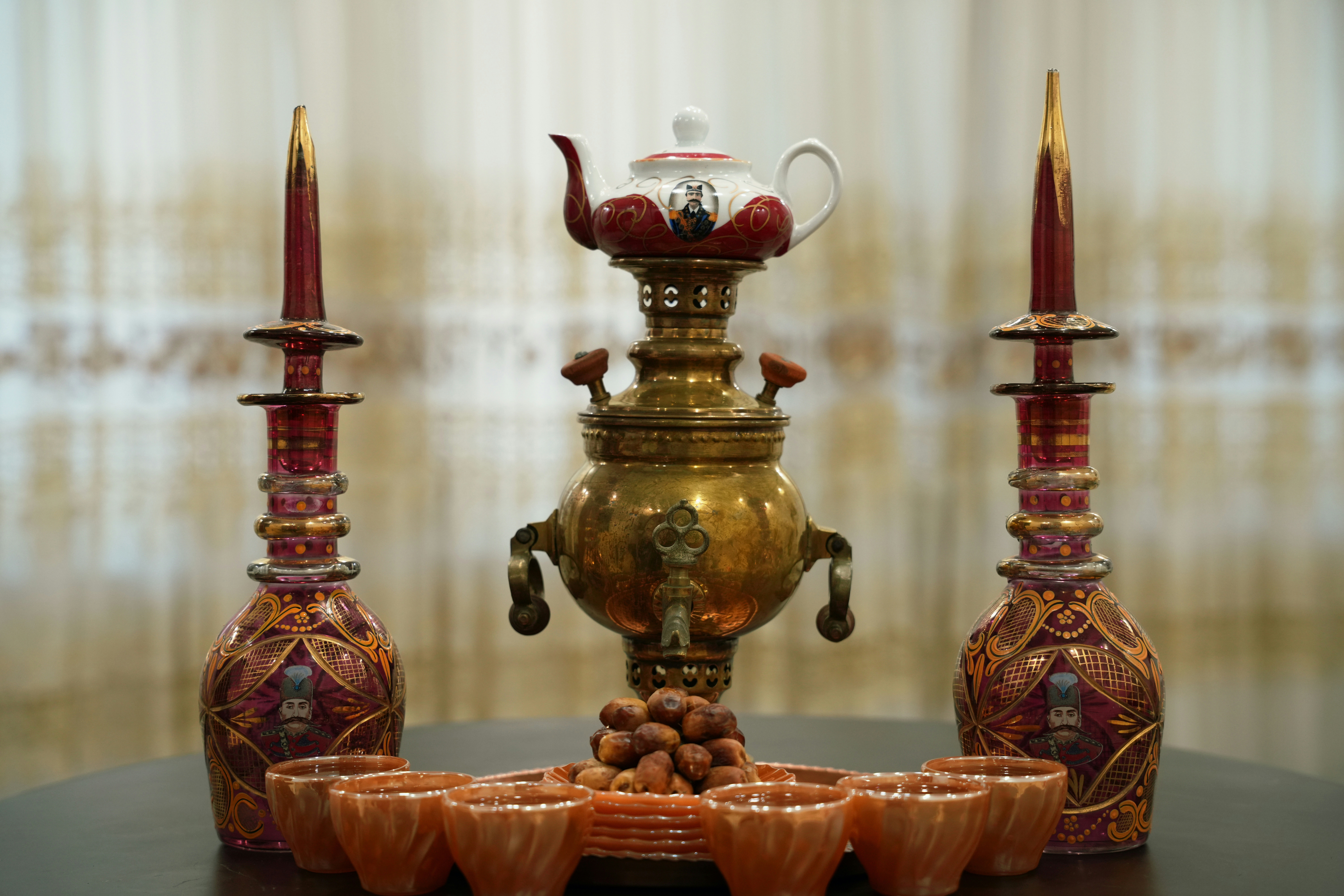 Brass Altarcrest: Tea Urn Centered Between Ornate Flasks