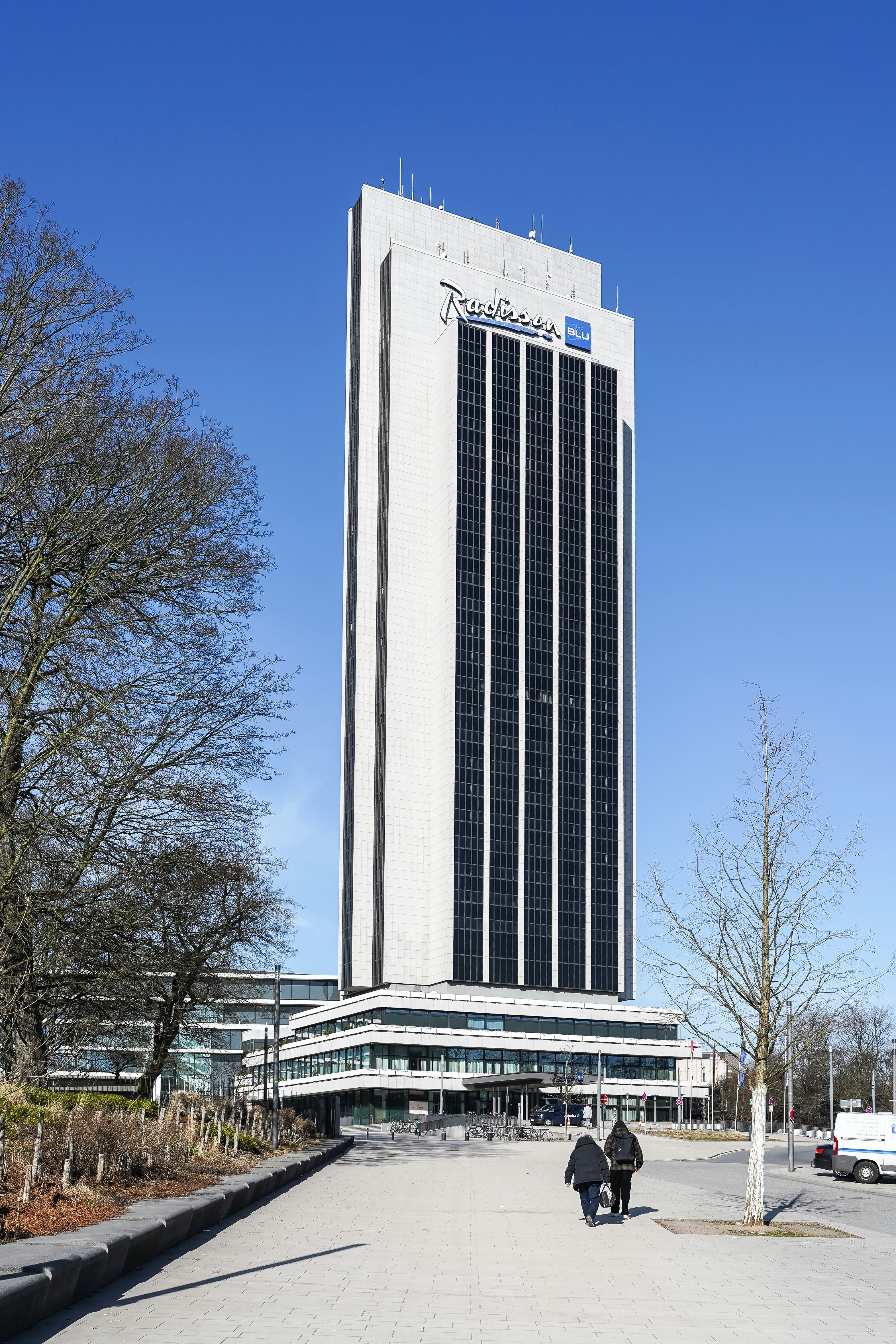 Skyline Sentinel: A Tower Reaching Toward a Clear Blue Sky