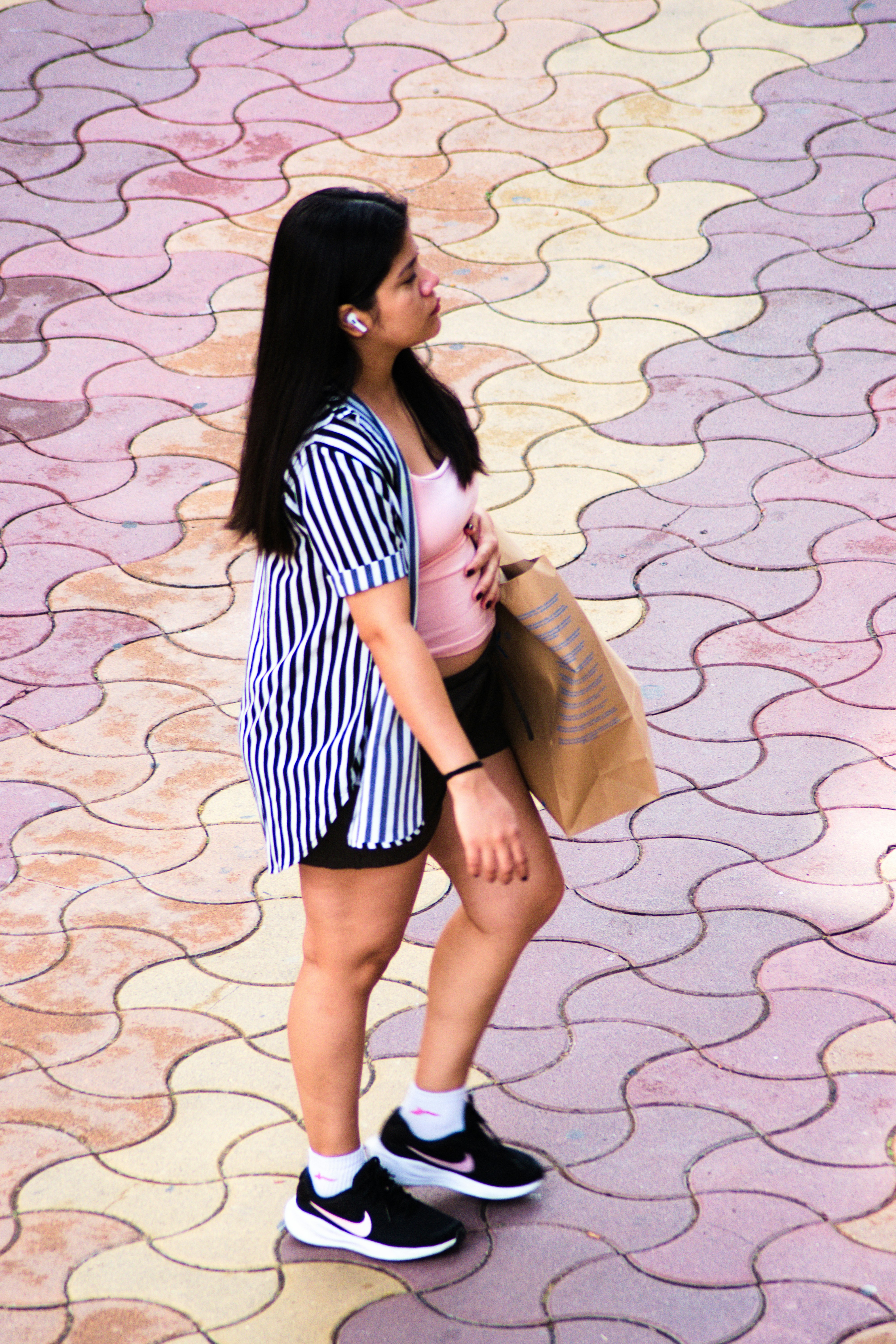 Stride through Color: A Side Portrait on Wavy Mosaic Tile