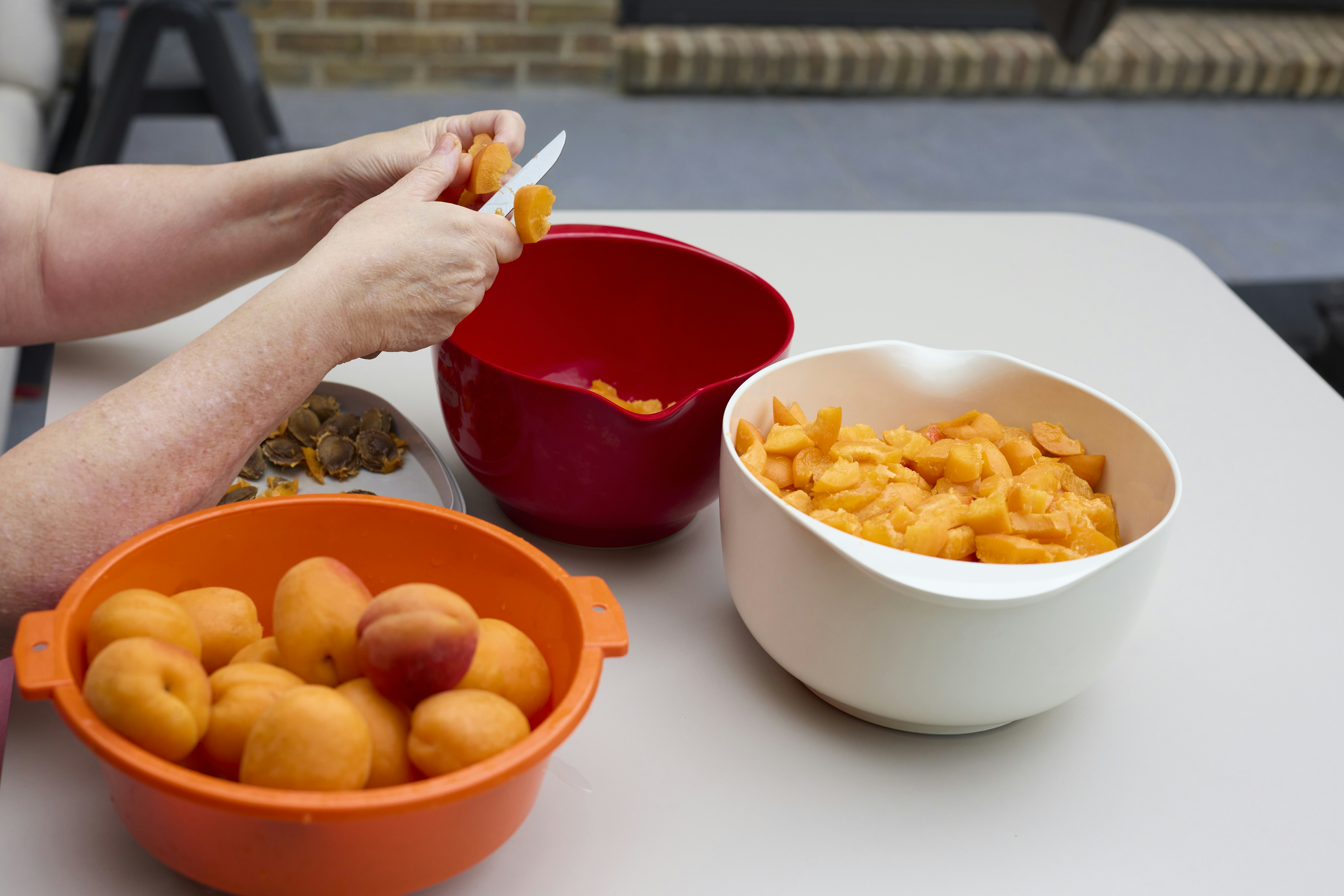 Hands at the Fruit Prep Station: Peels and Pieces