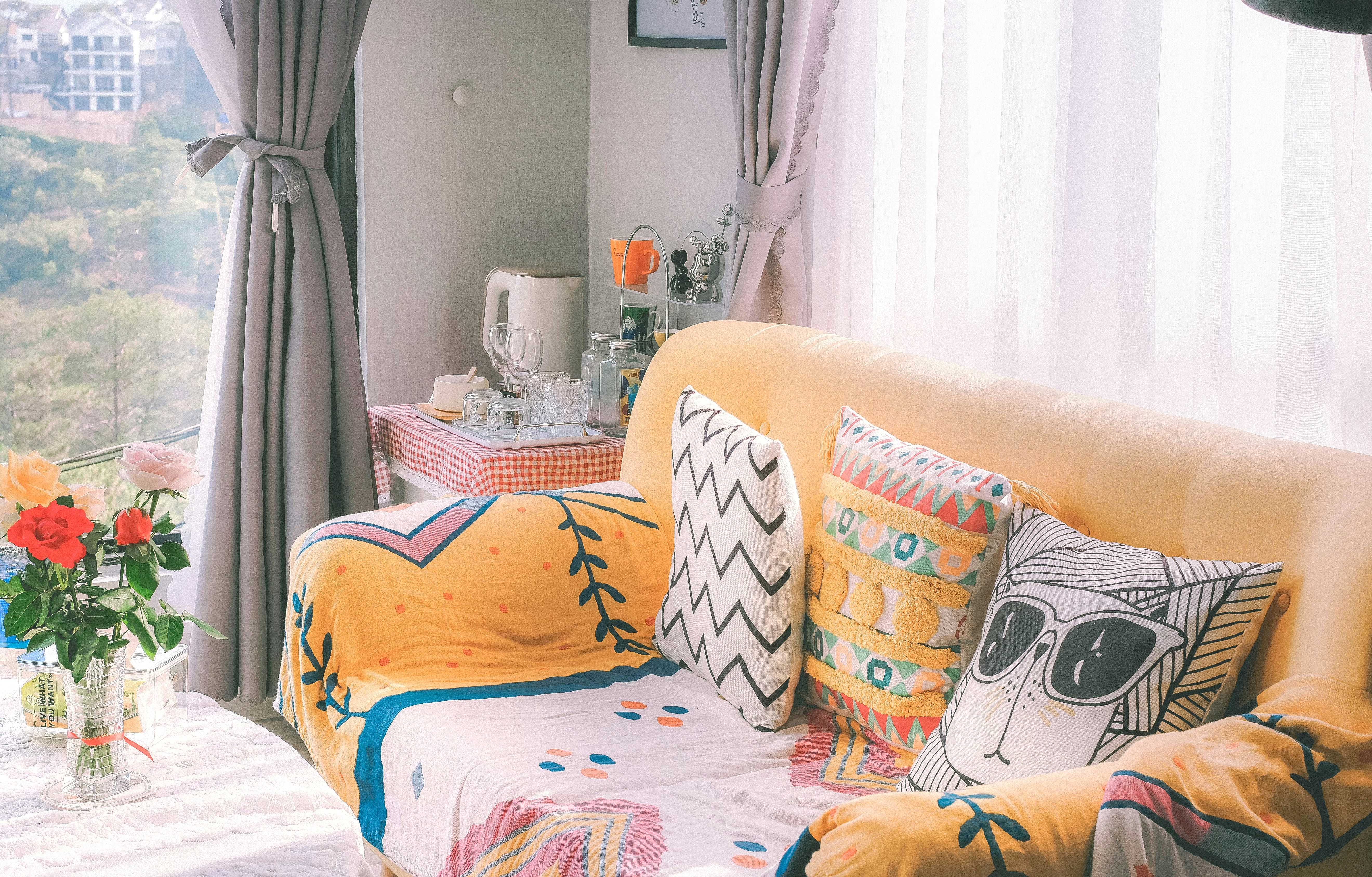 Sunlit Splash: Colorful Sofa Oasis by the Window