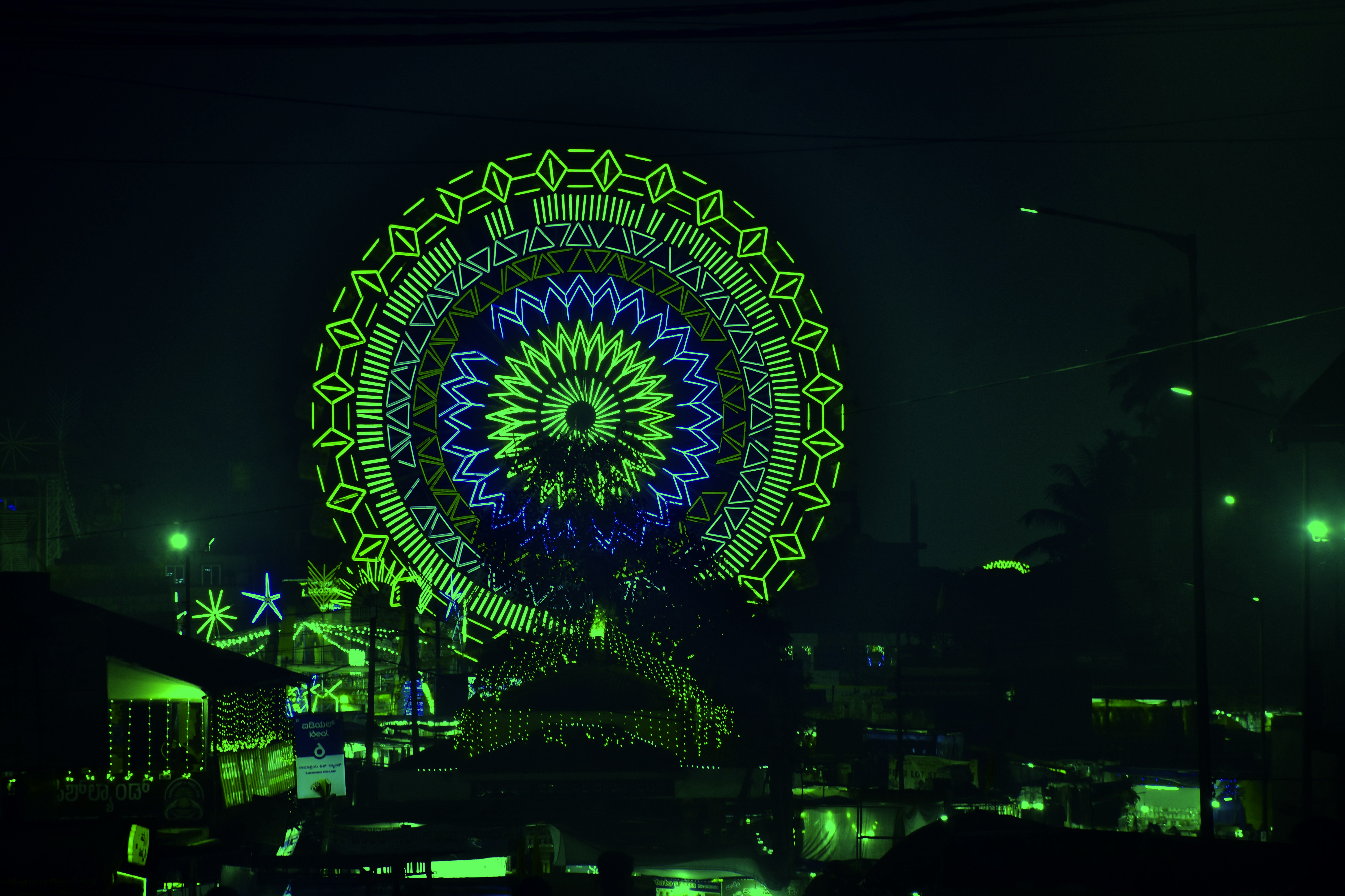 Neon Mandala Over the Pier at Night