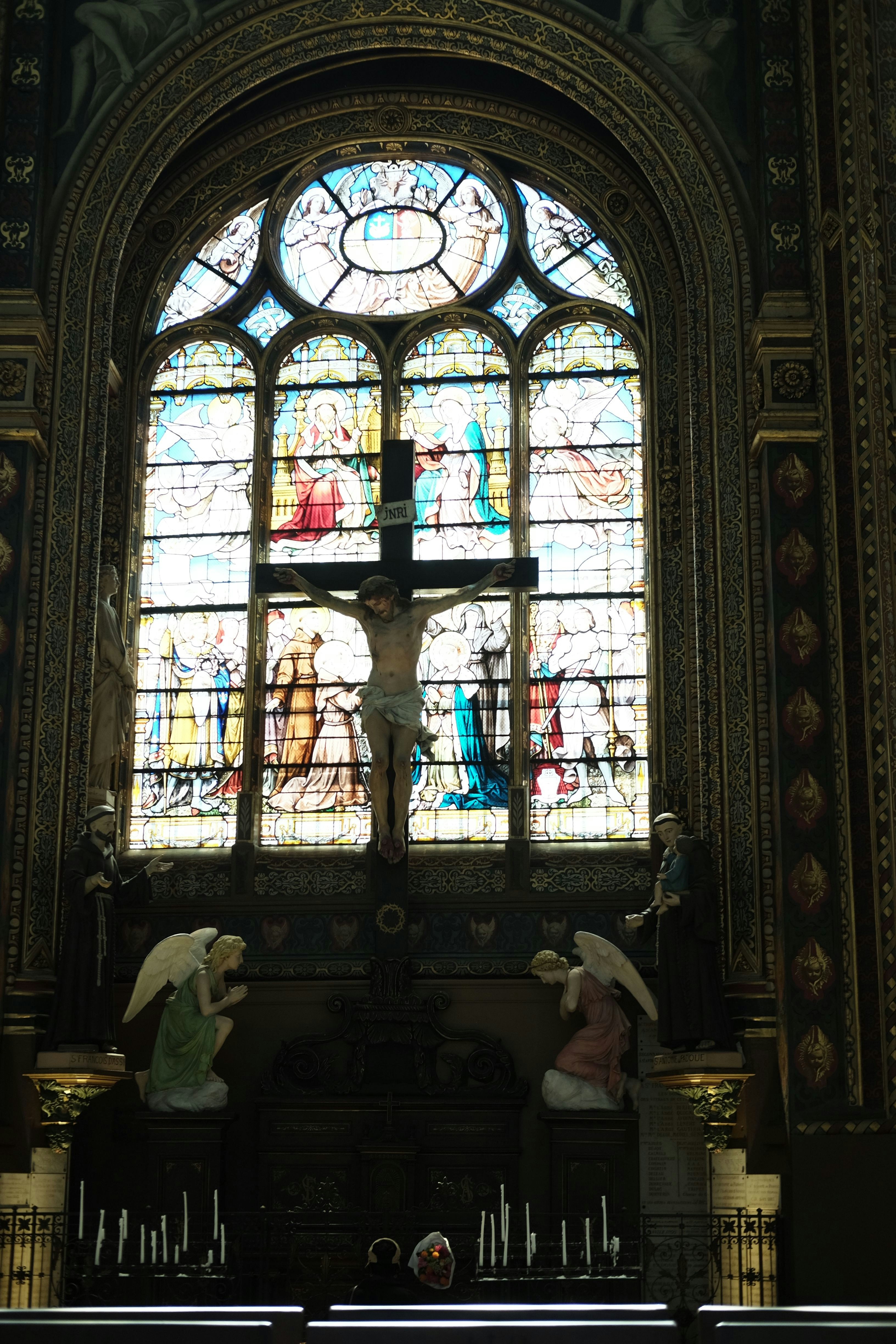 Crucifixion in Stained Glass: Reverent Light Through Gothic Arch