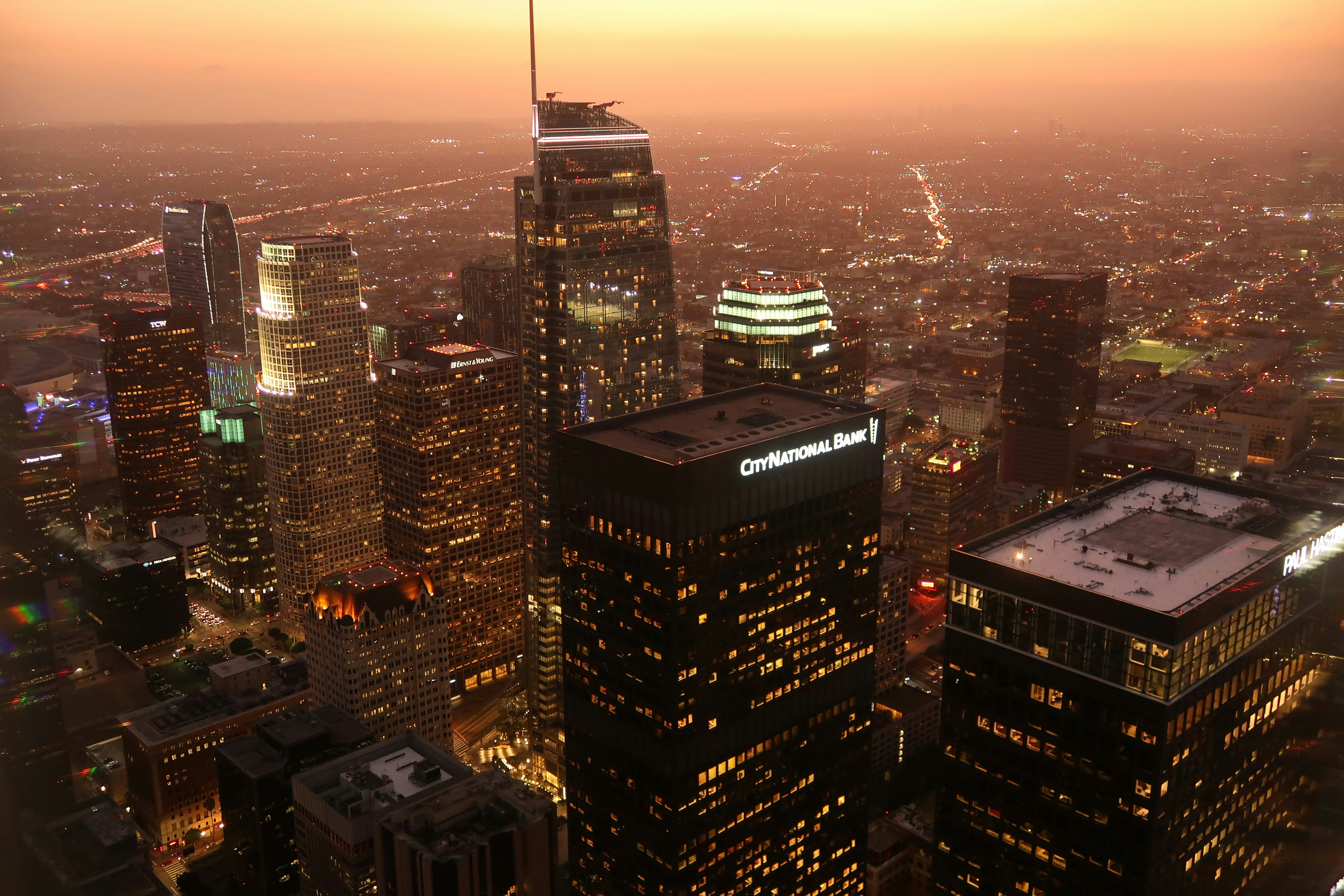 Midnight Summit: A Neon Crown Over a Distant River of Lights