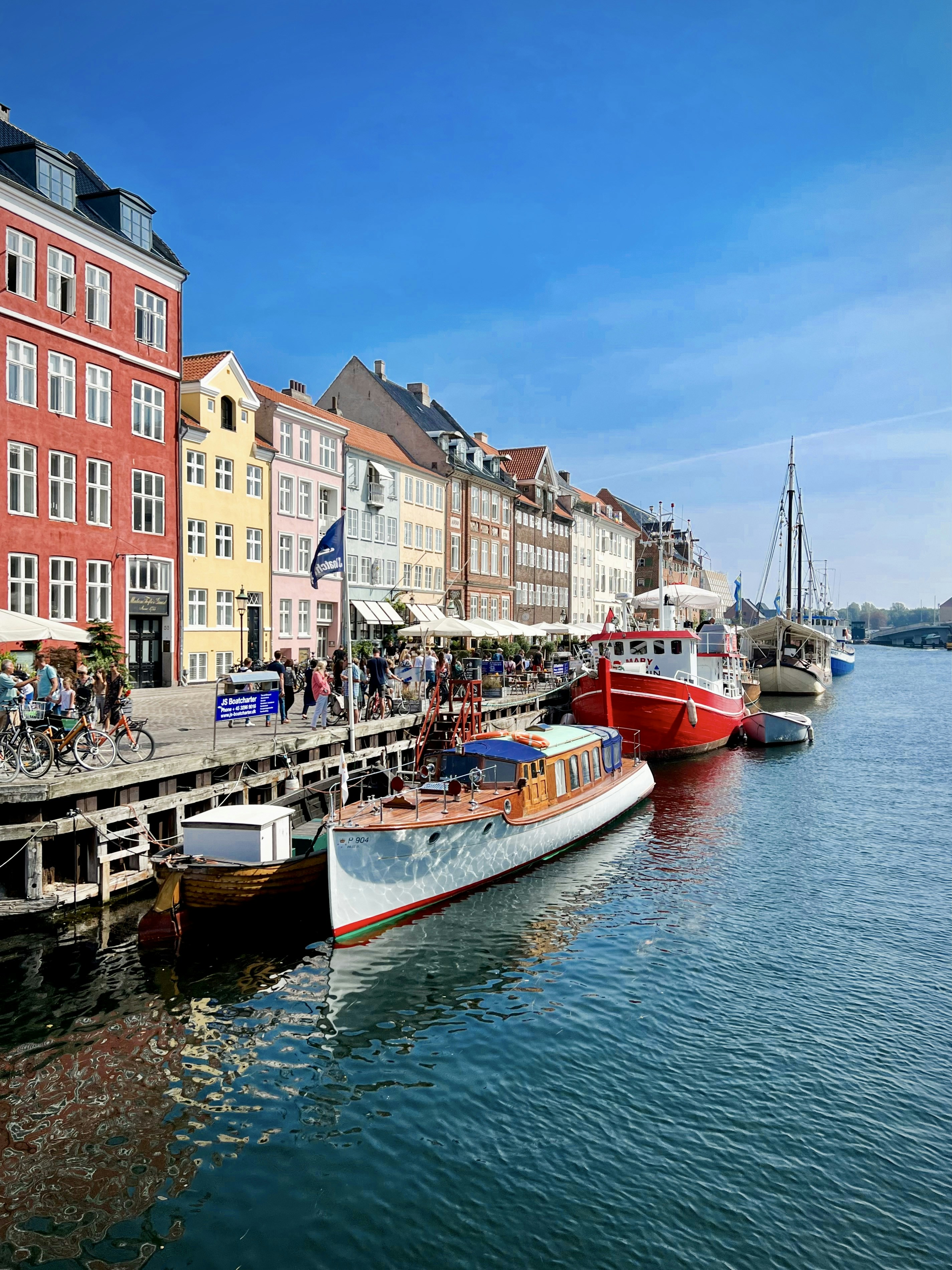 Colorful Coastal Row: Boats and Townfront along the Waterfront