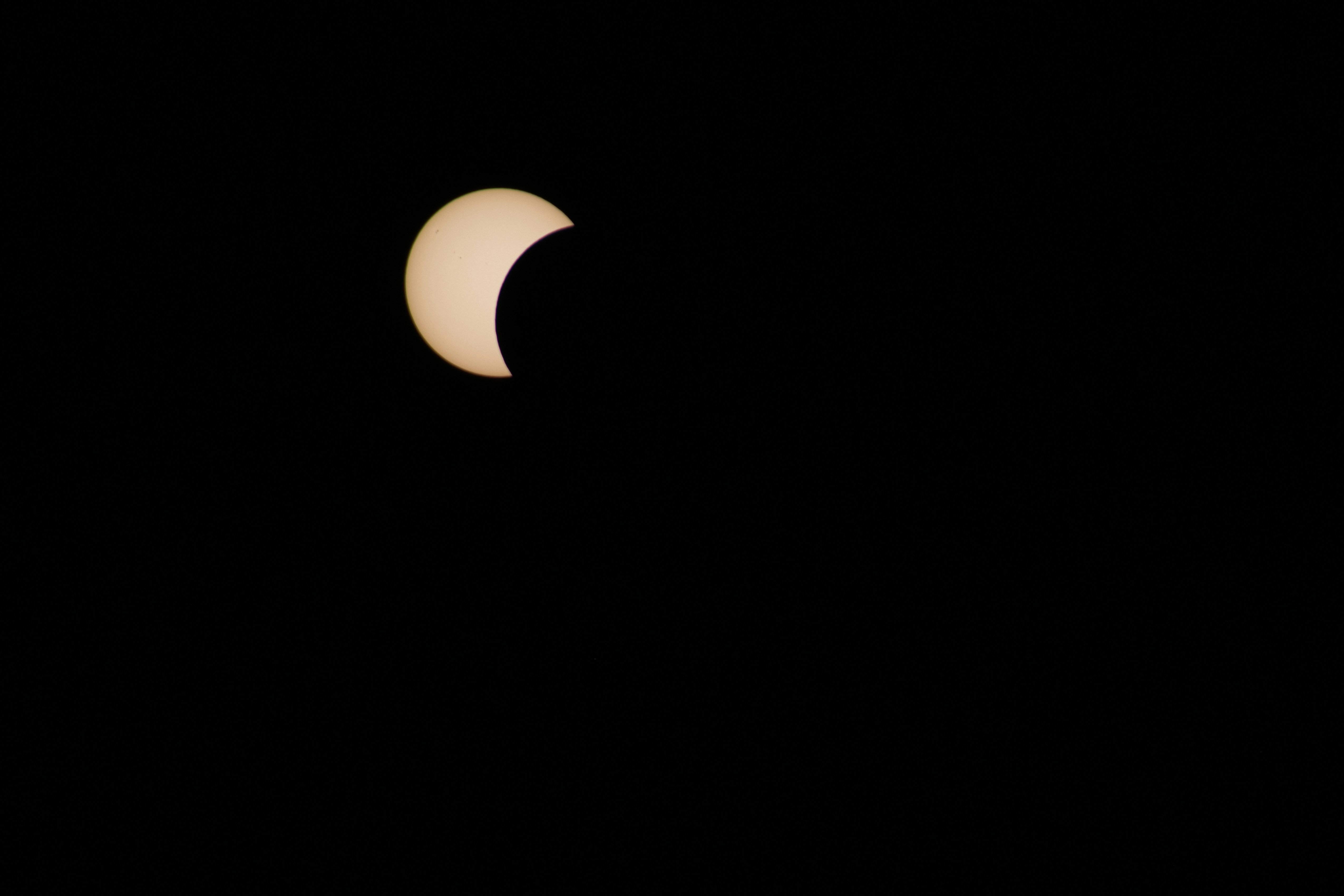 Partial Solar Eclipse Over a Night Sky