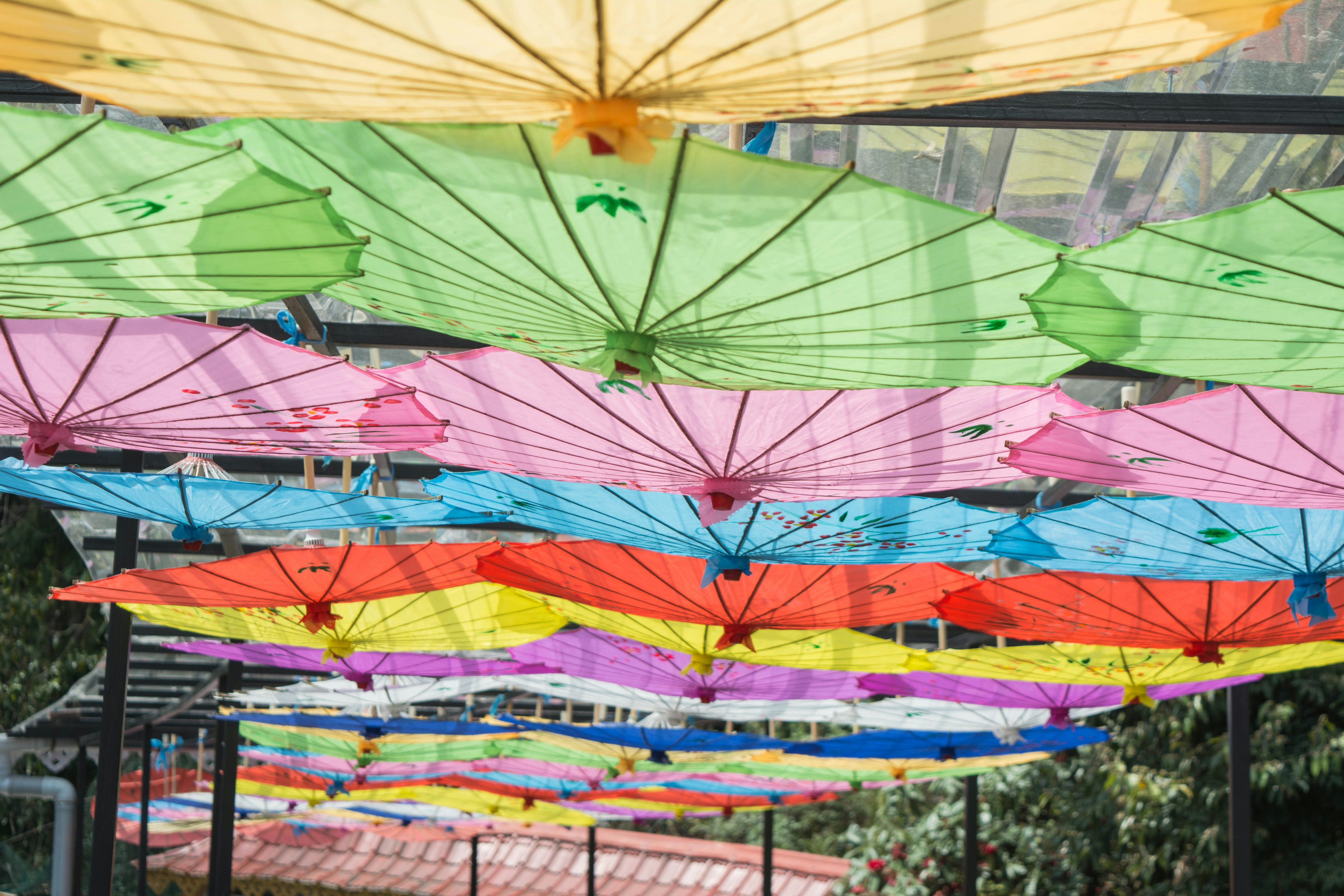 Rainbow Canopy: A Street Corridor of Floating Umbrellas