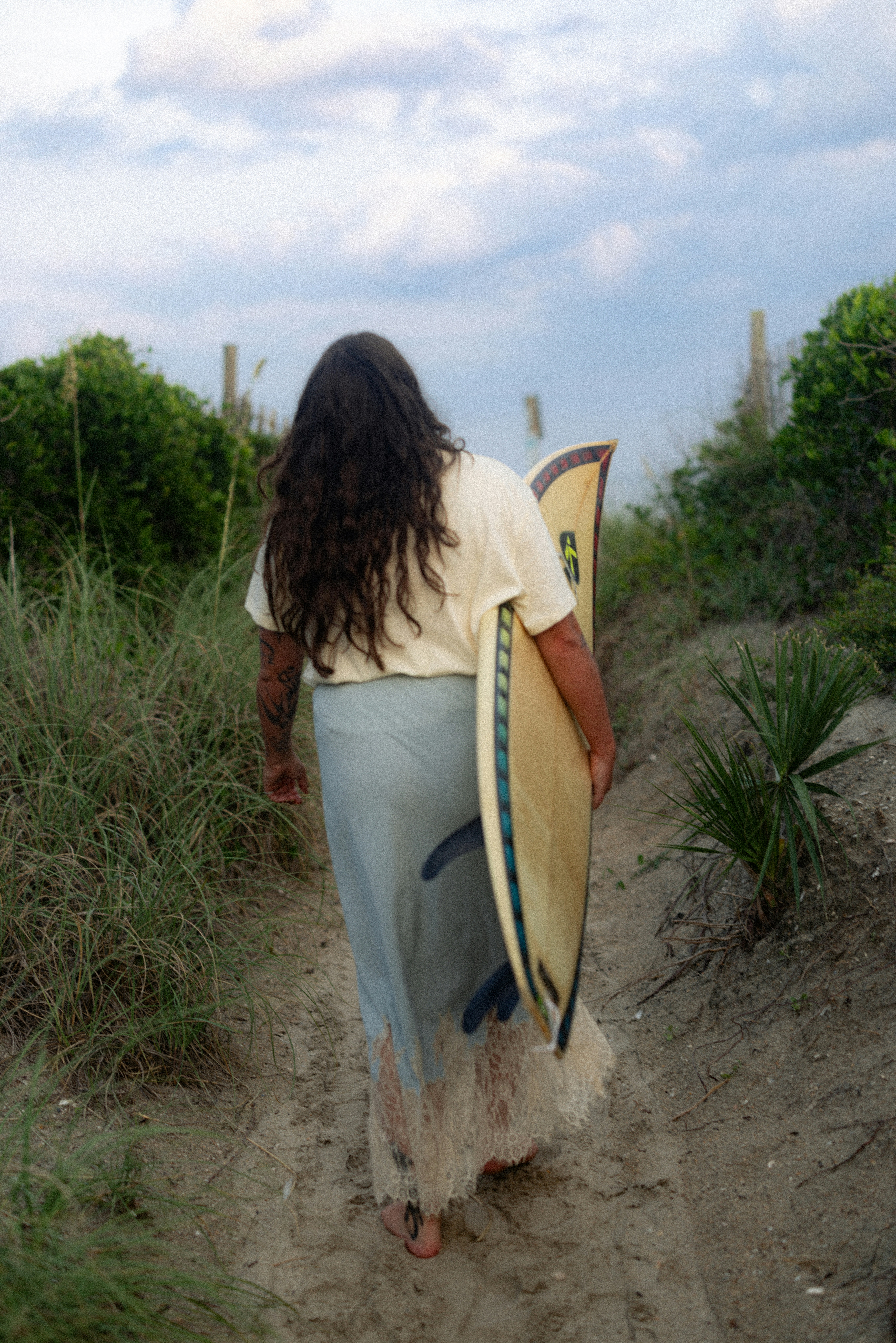Surfside Walk: A Lone Surfer Heads Toward the Shore