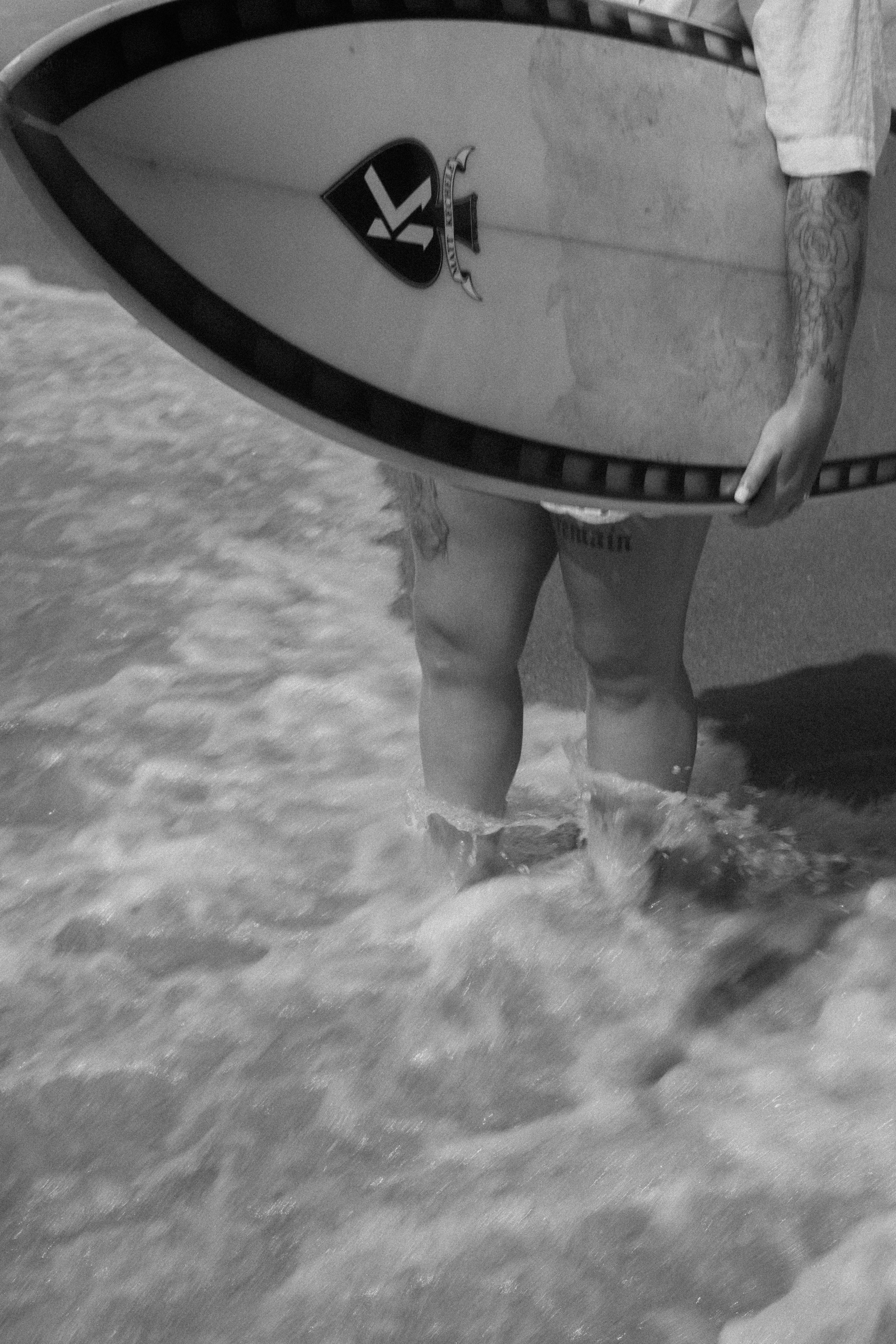 Surfboard at Shoreline: A Quiet Moment in the Water