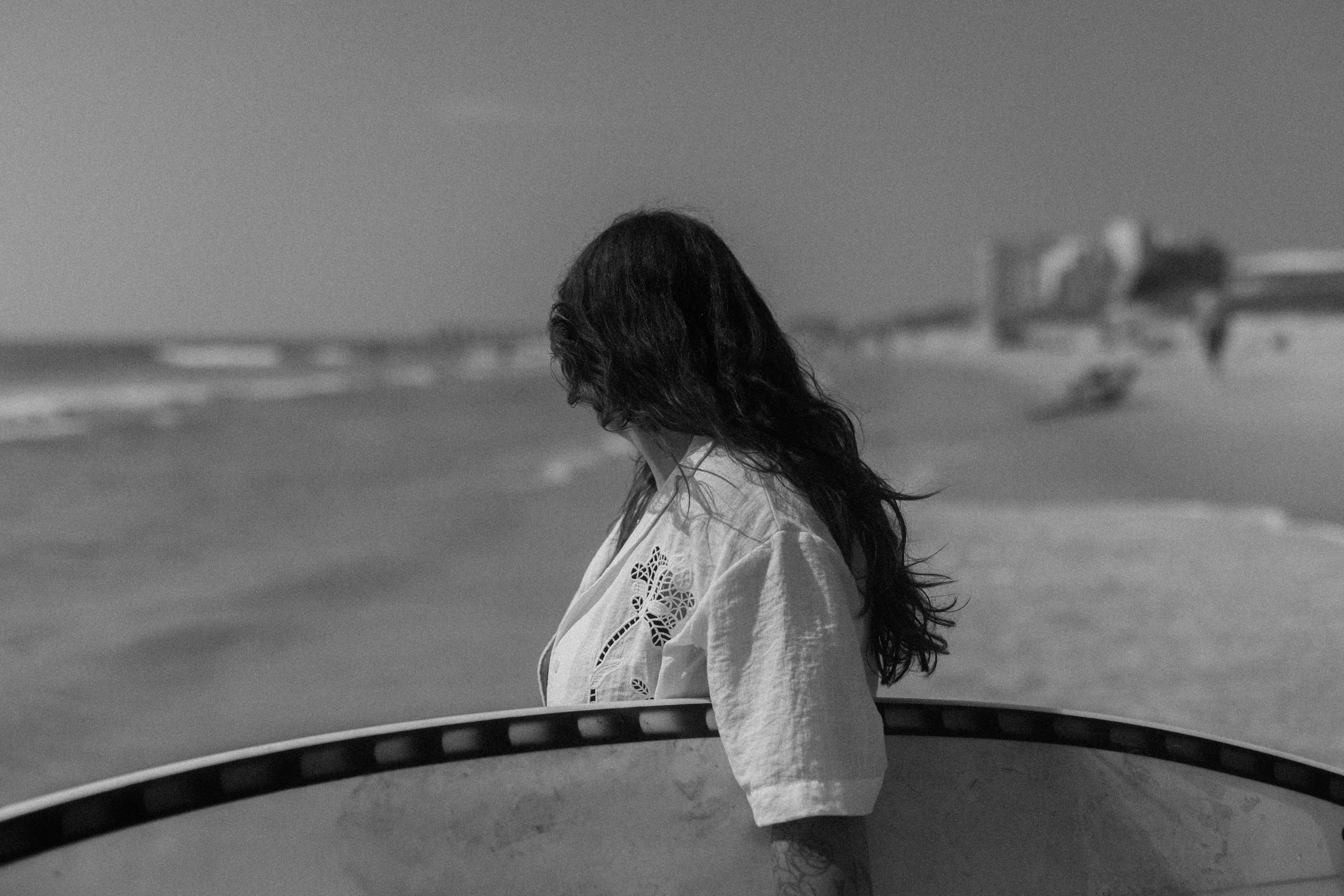 Surfboard silhouette and shoreline confidante