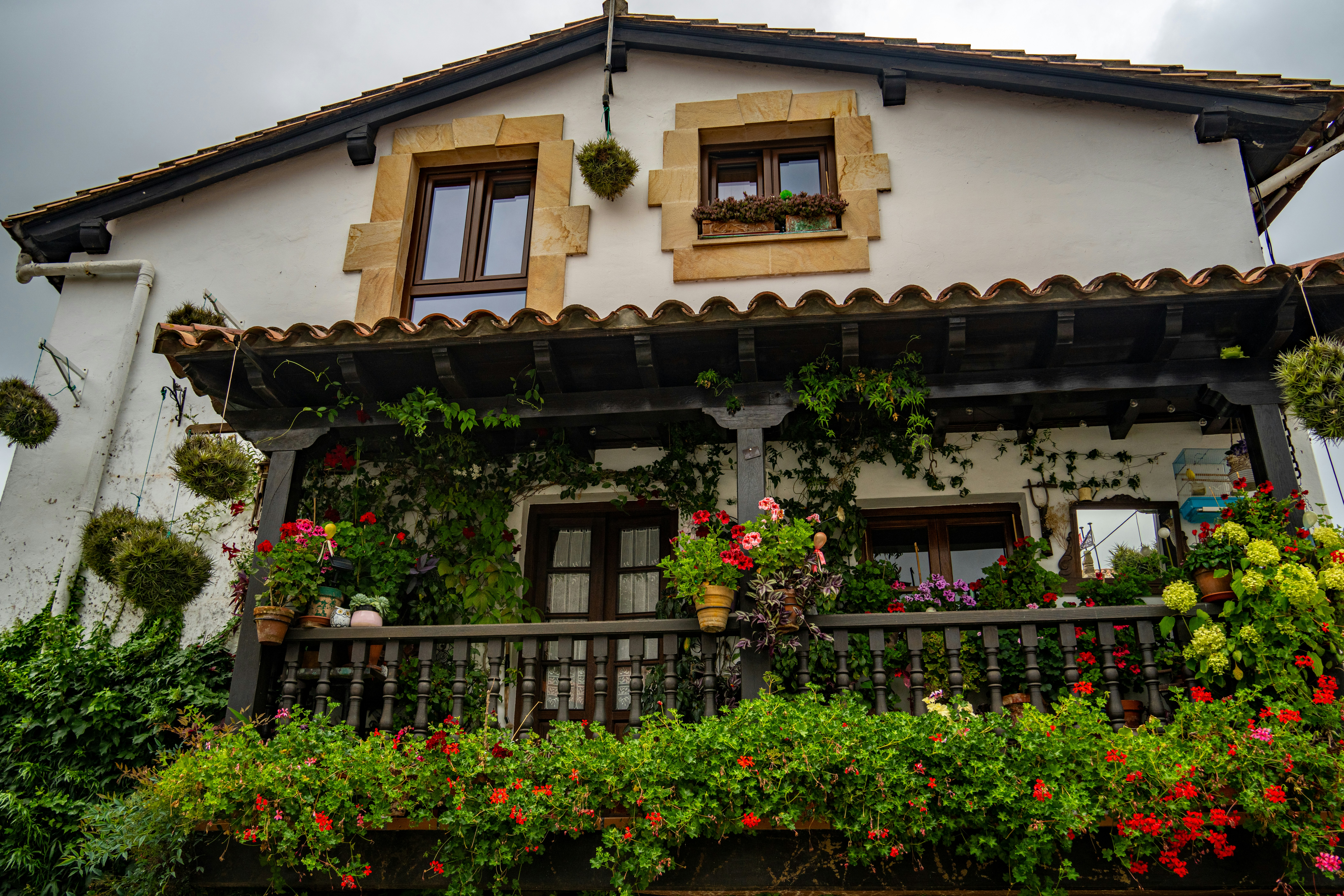 Floral Balcony Overlook on a Rustic European Cottage