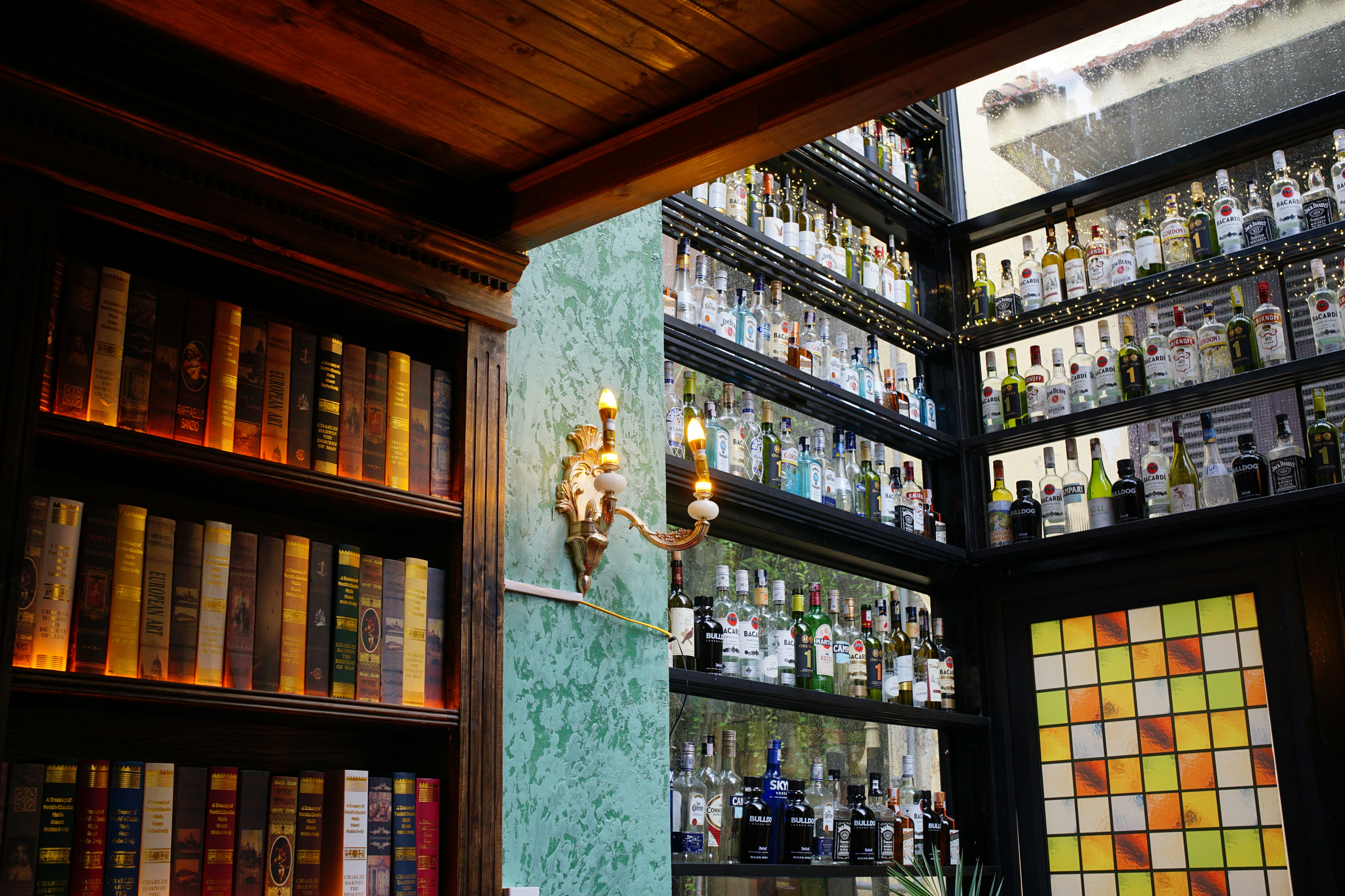 Liquid Library: Bottles and Books in a Vintage Bar Corner