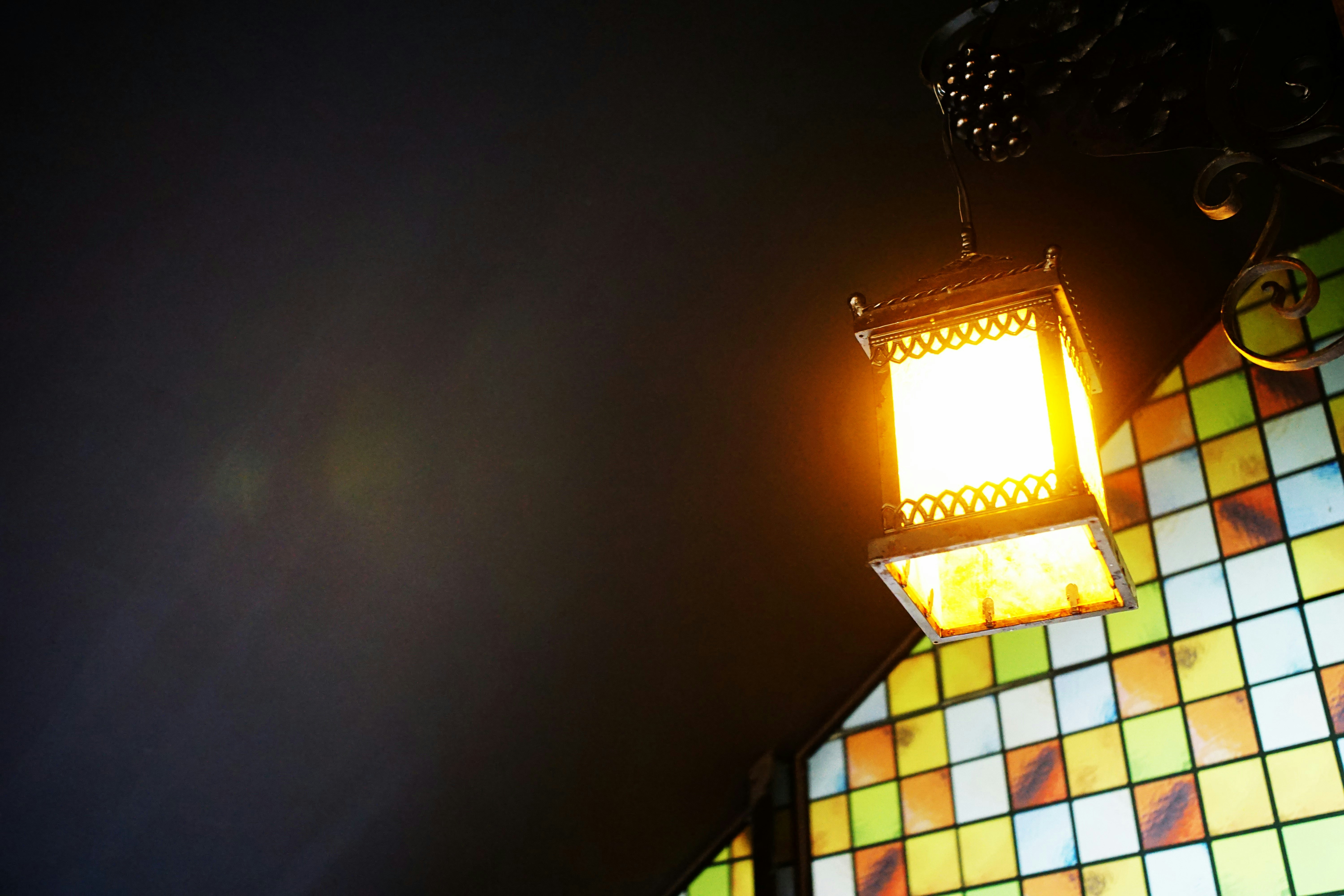 Glowing Lantern Against Mosaic Night