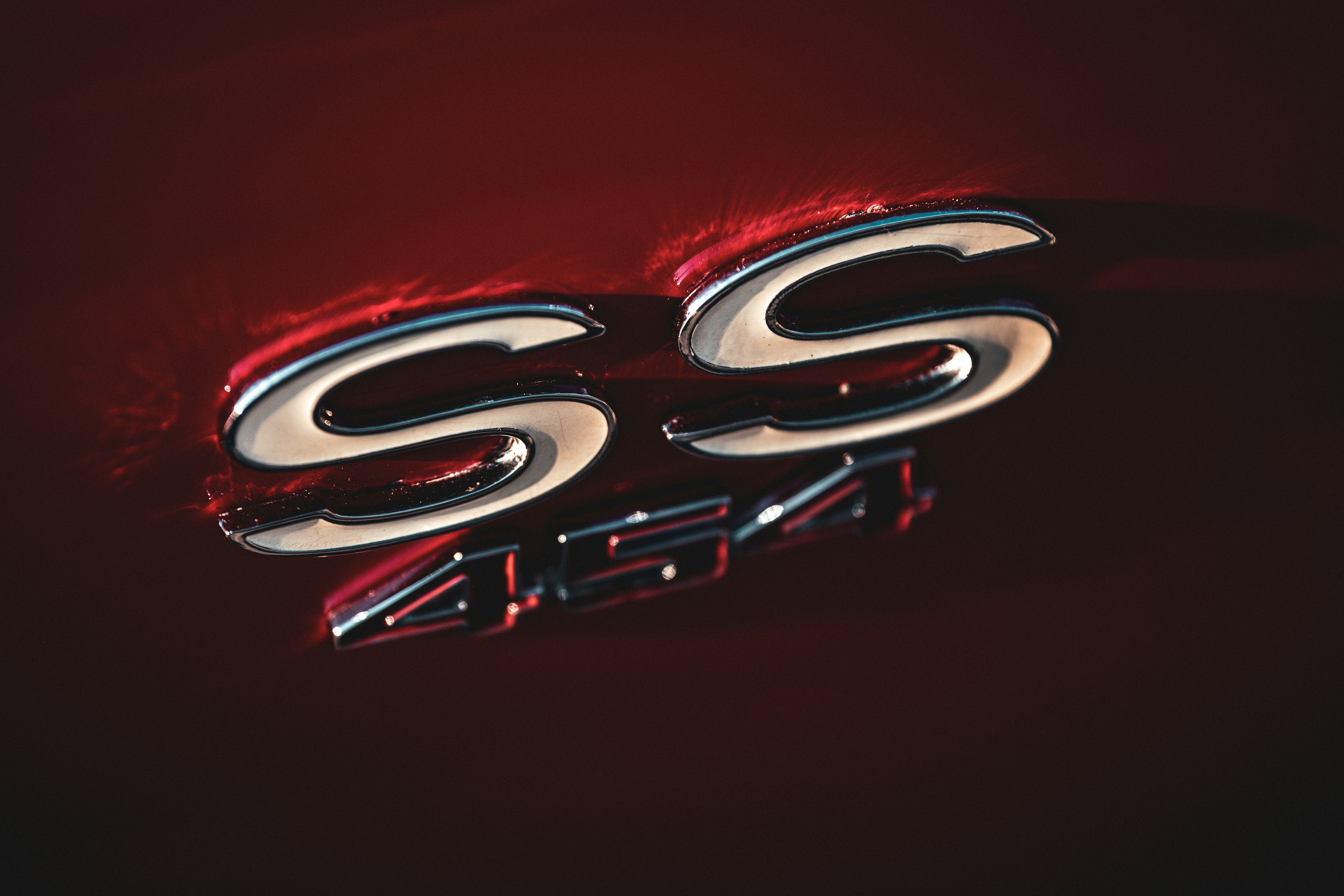 Glossy SS badge on a crimson vintage finish