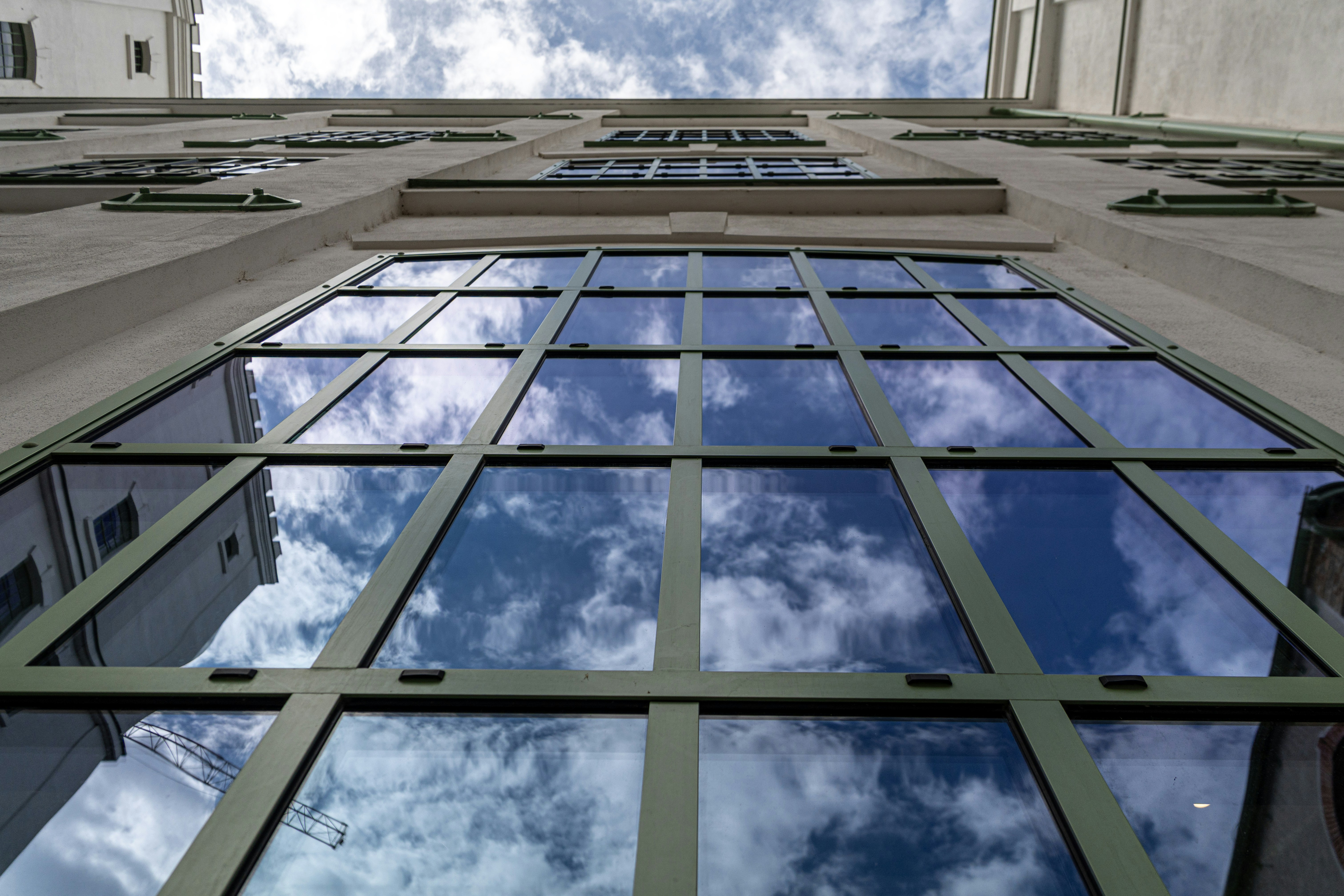 Skyward Glass: Reflections and Gridded Facade