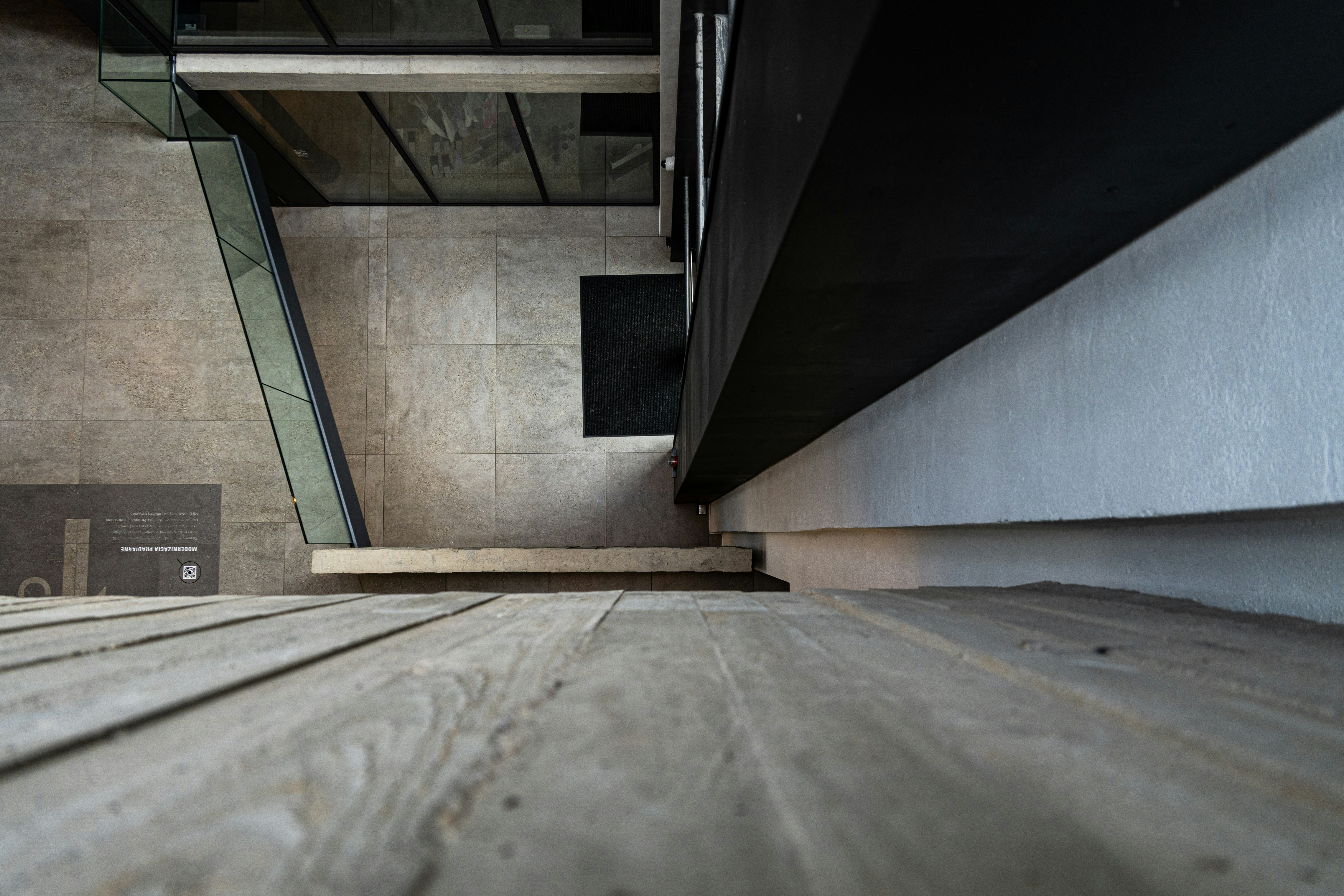 Concrete Perspective: Aerial View into a Modern Atrium