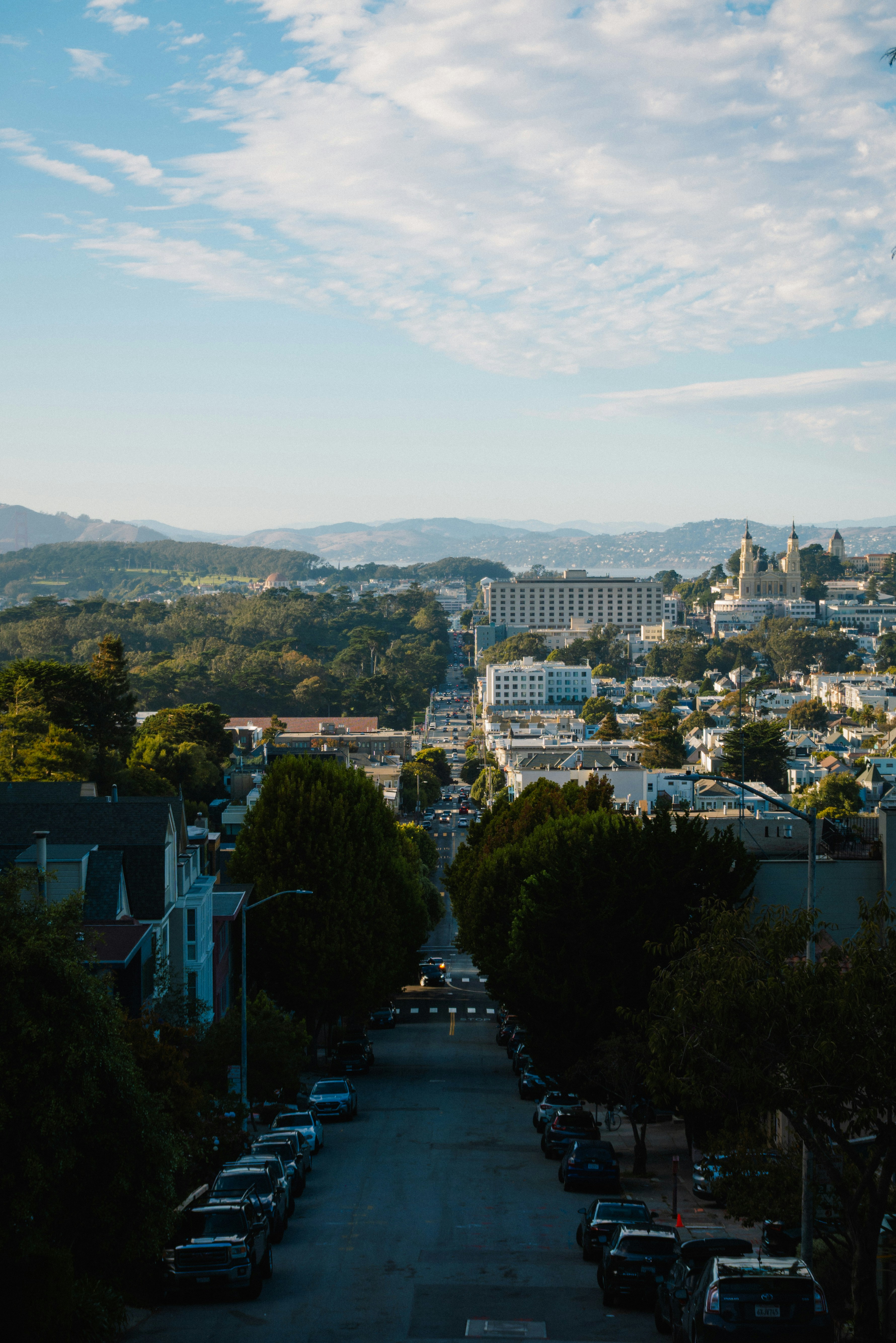 City Boulevard at Dusk: A Quiet Descent Toward the Hills