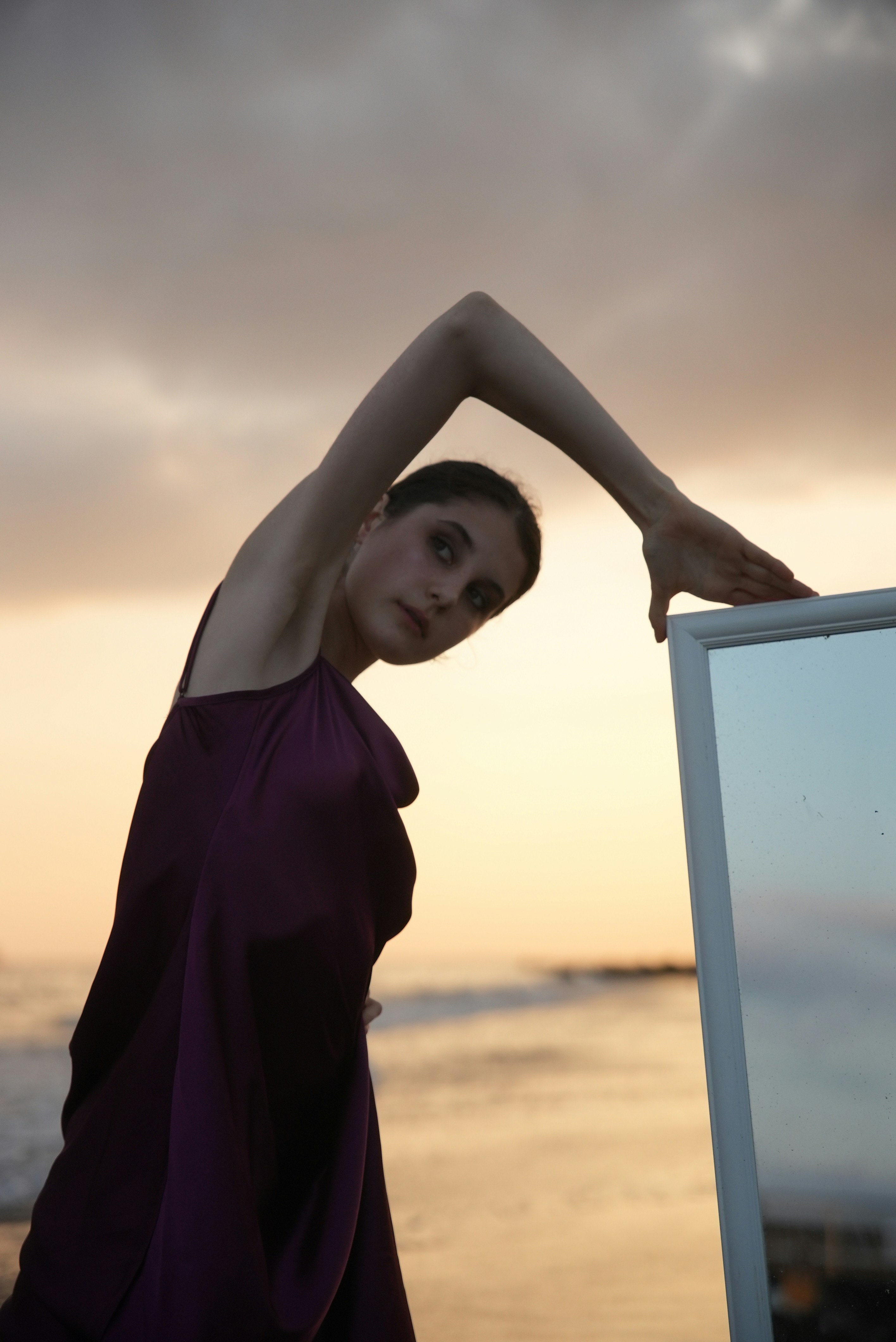 Silhouette in Golden Frame: A Dance by the Sea at Sunset