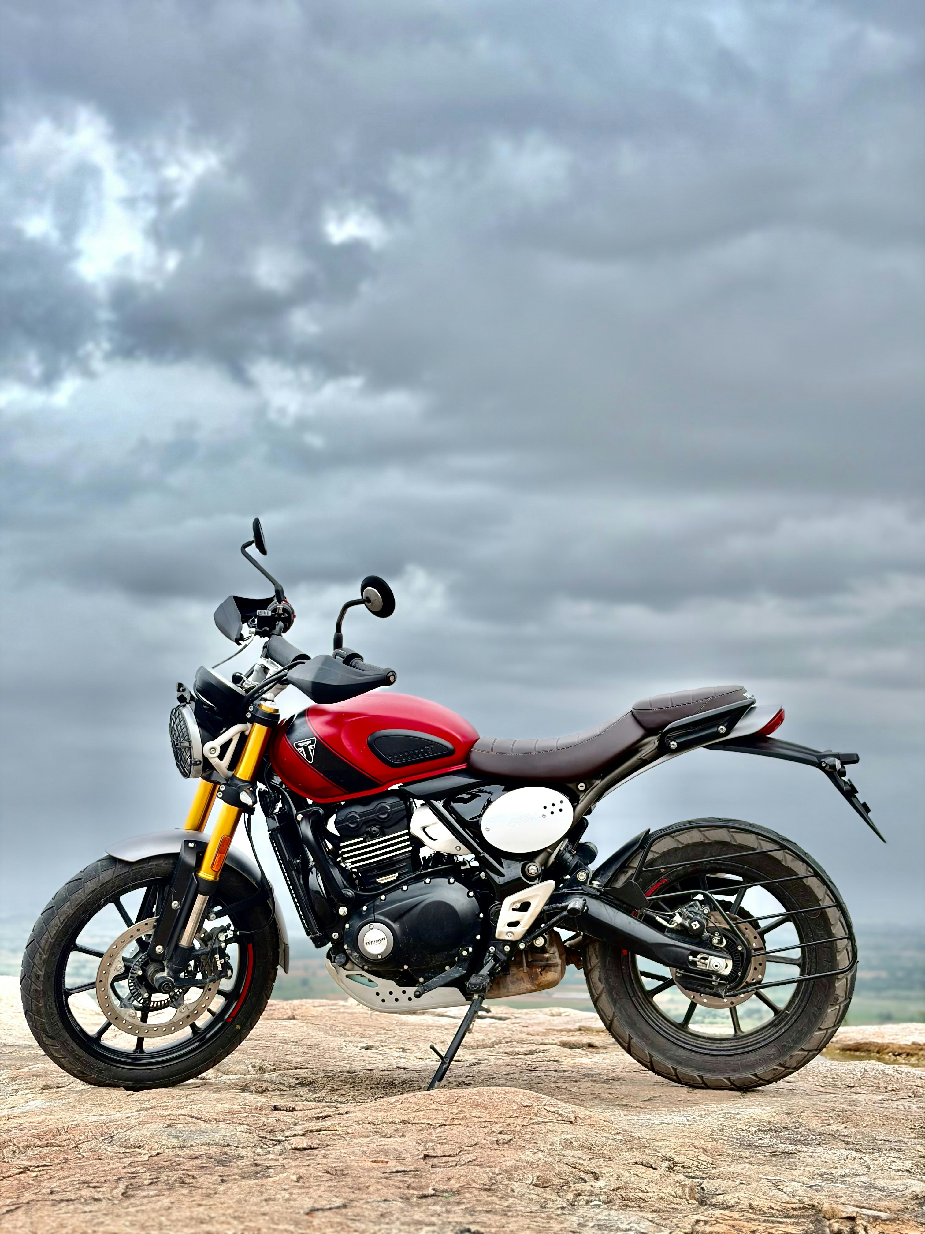 Red Disc Moto on a Windswept Cliff