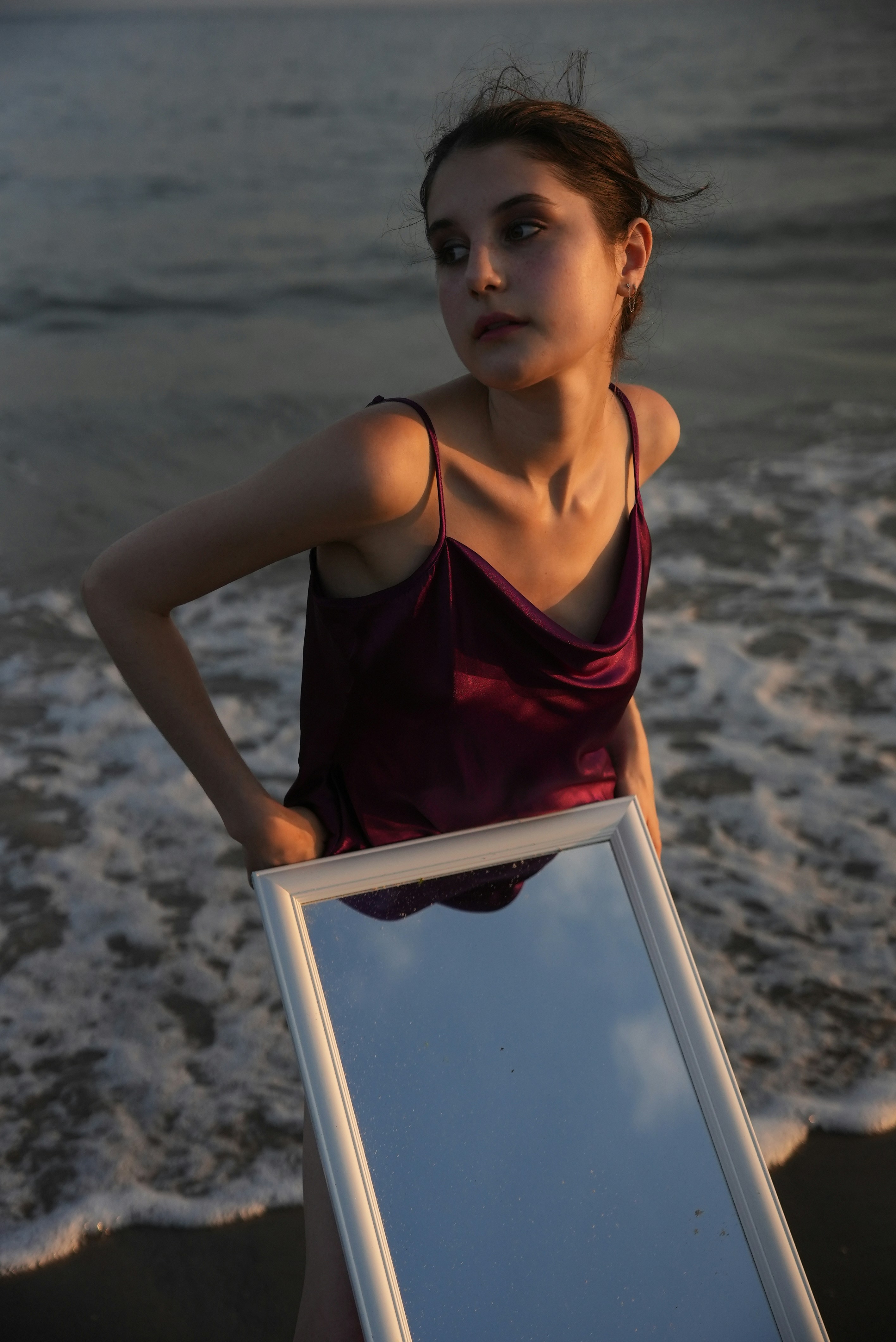 Portrait by the Sea: A Quiet Gaze with a Reflective Frame
