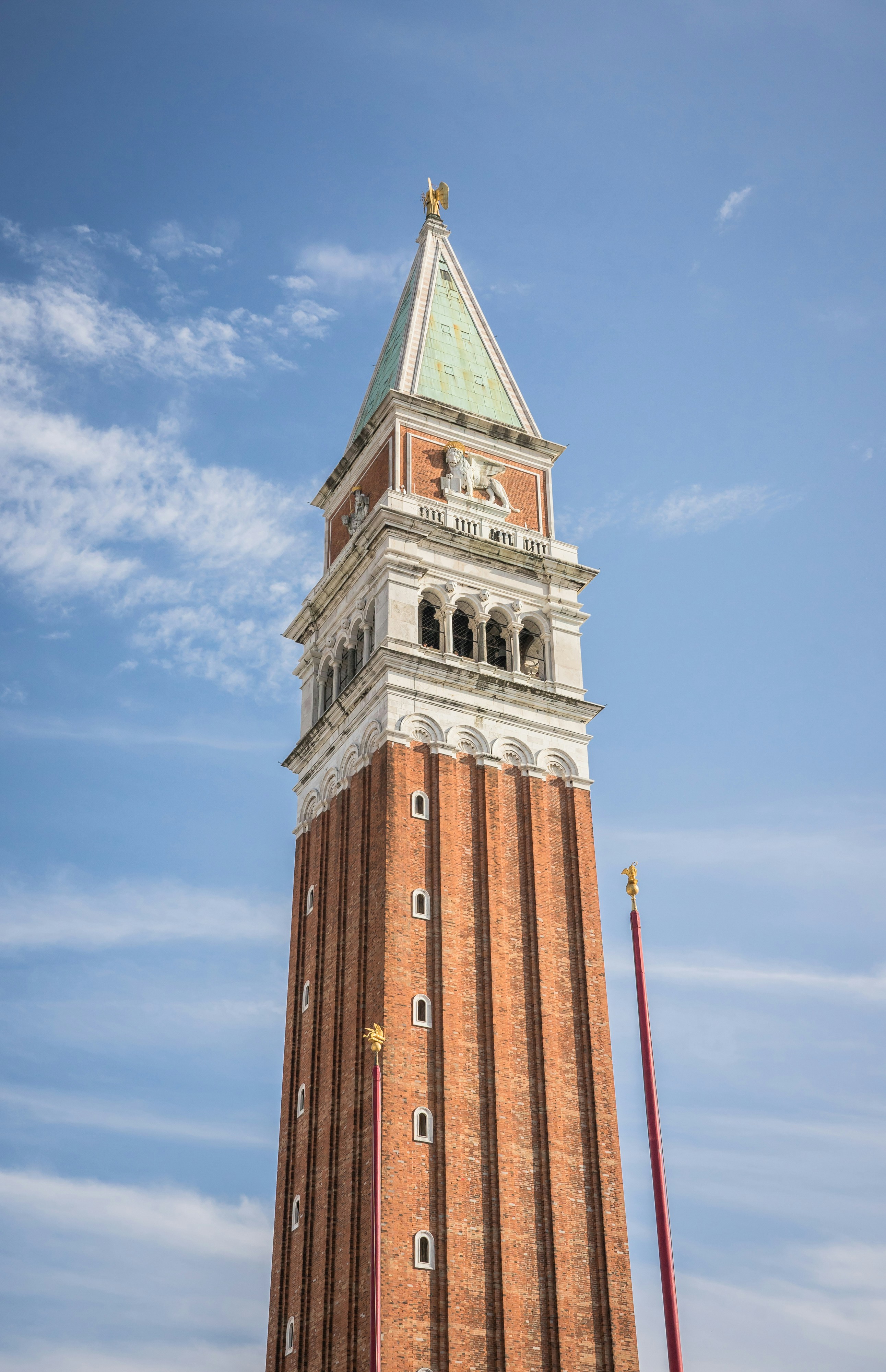Crowning Spire: A Venetian Clocktower Reaches Toward a Clear Sky