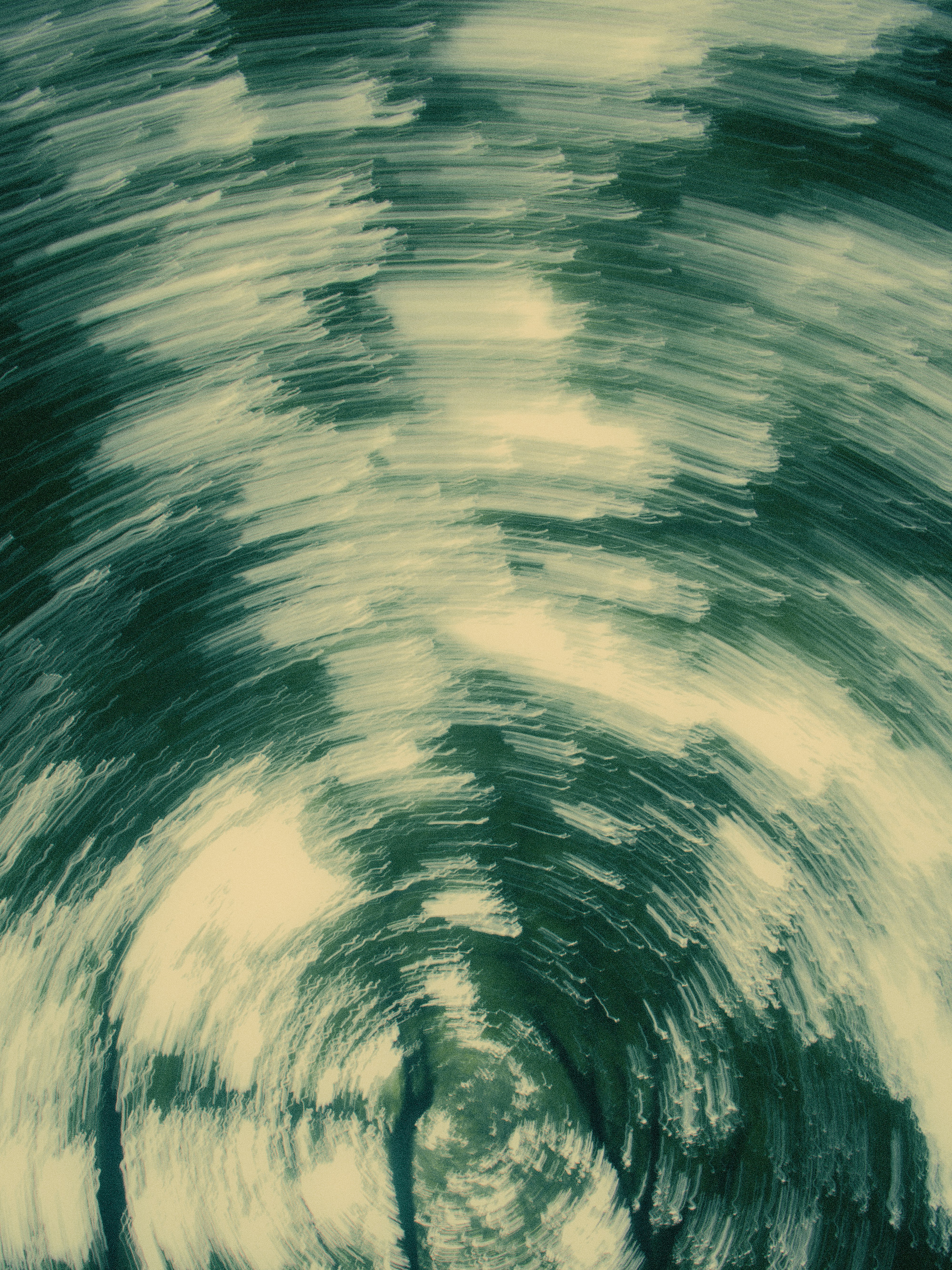 Spiral Vortex: Concentric Ripples in Turquoise Light
