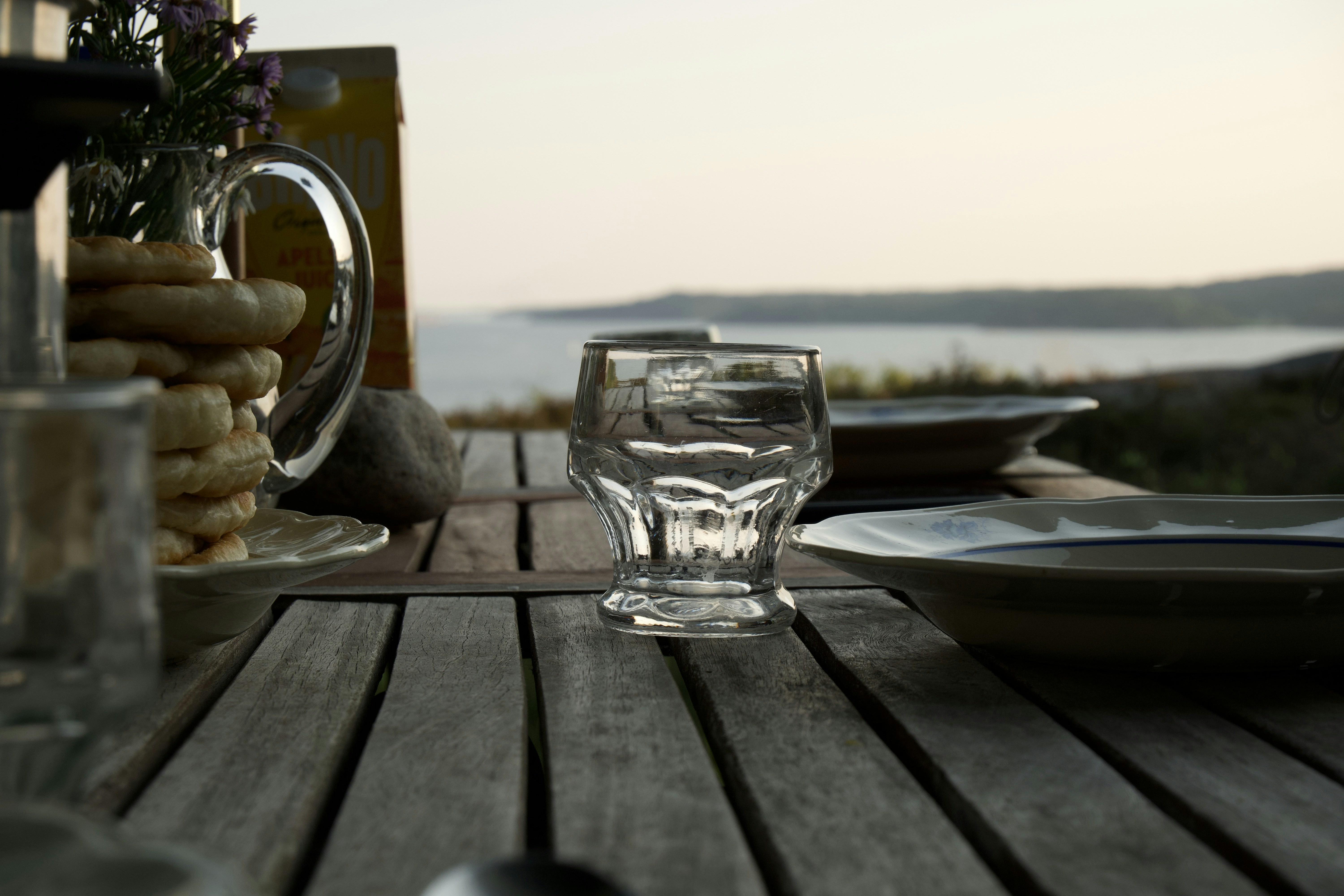 Glass on a Quiet Table, Sunset Reflections over the Waterfront