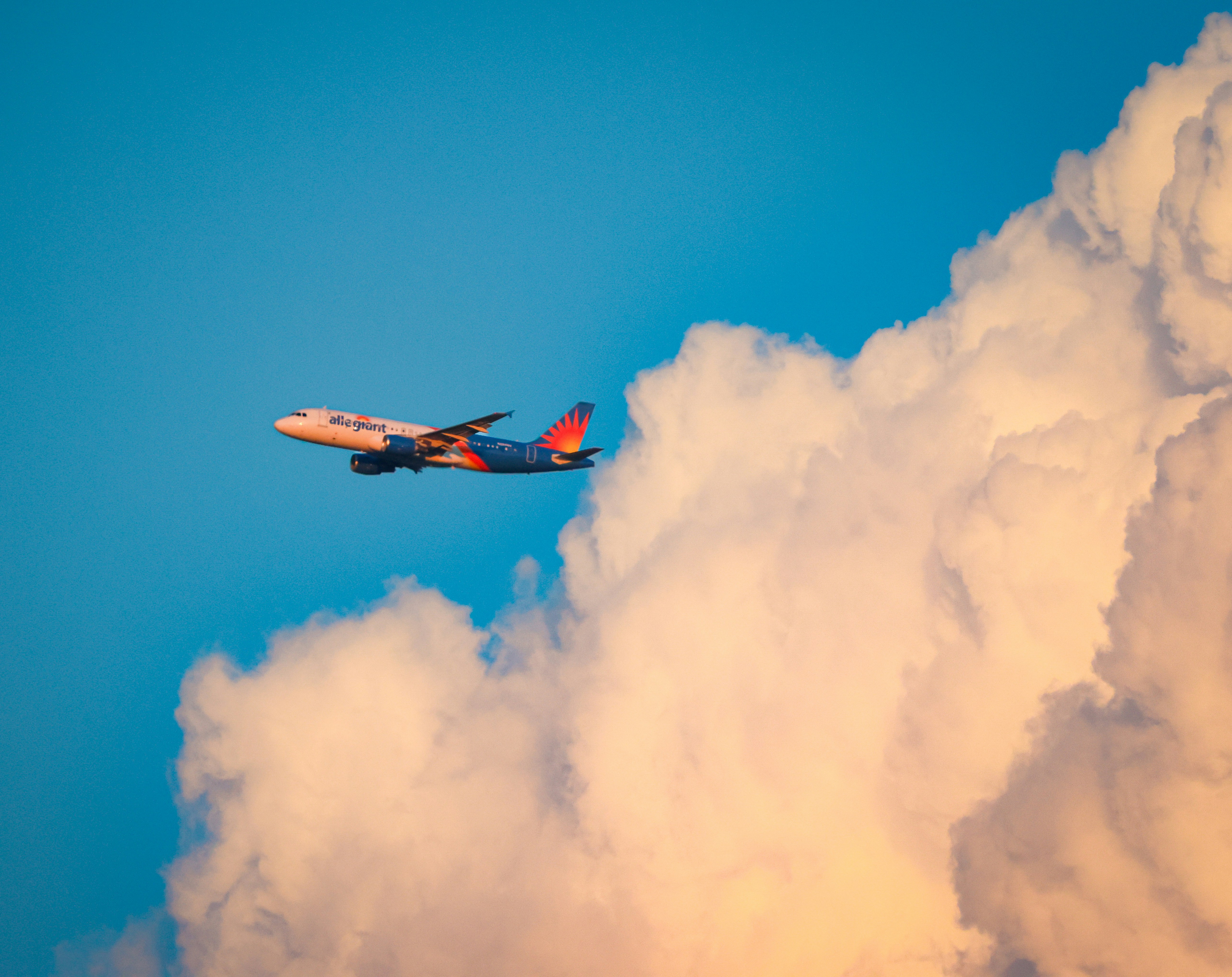 Airliner in a sunlit cloudscape